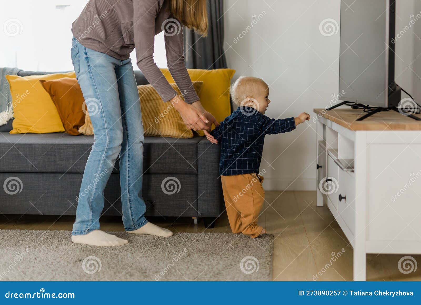 Baby Taking First Steps with Mother& X27;s Help at Home Stock Image ...