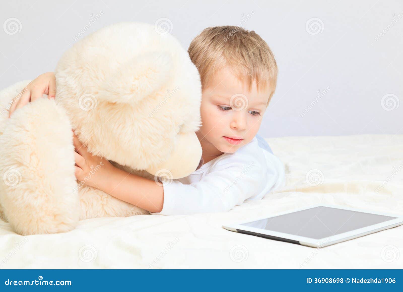 Baby and Teddy Bear with Touch Pad at Home Stock Photo - Image of ...