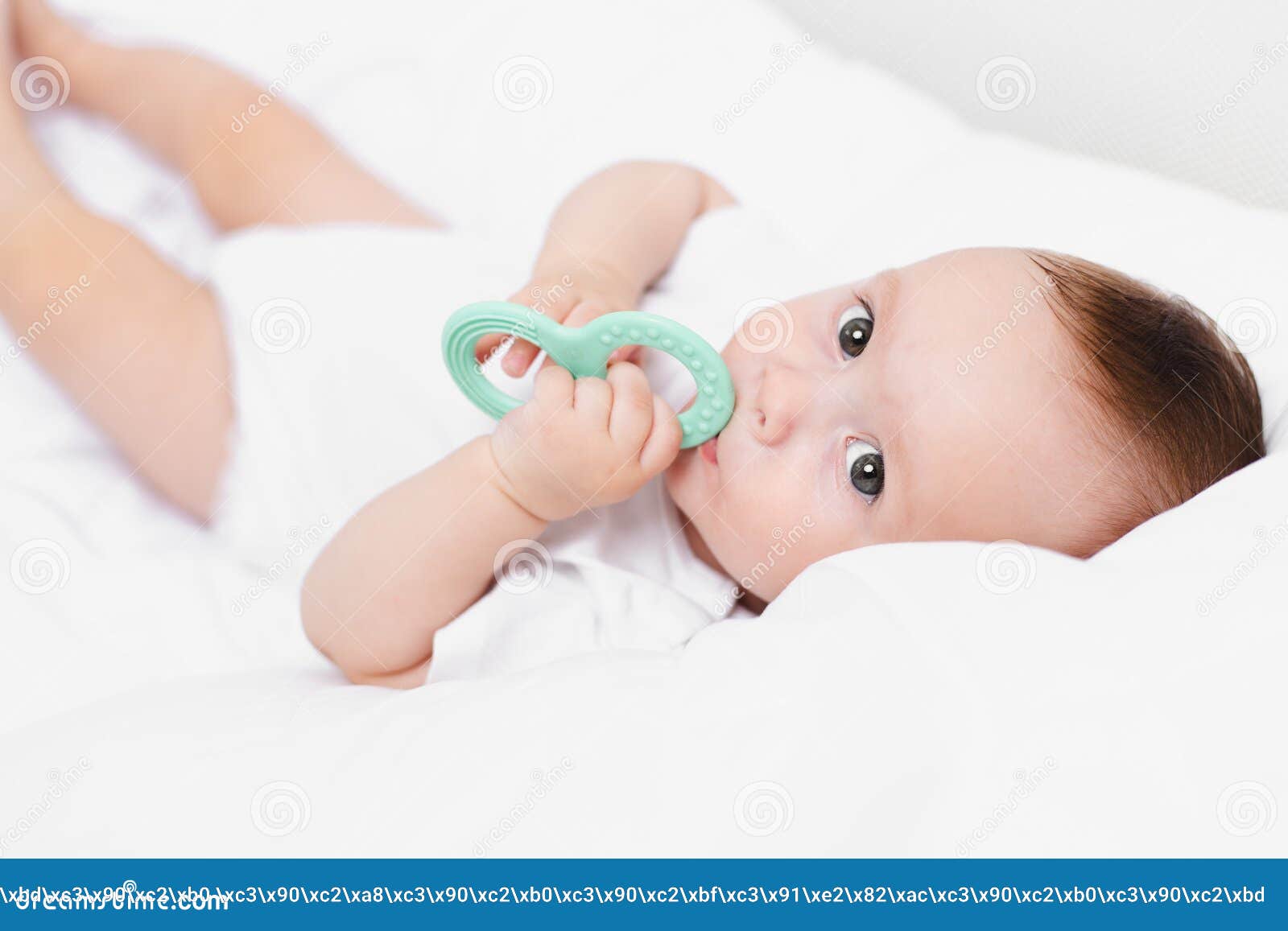 A Baby with a Teether on a White Background . Teething. Children& X27;s ...