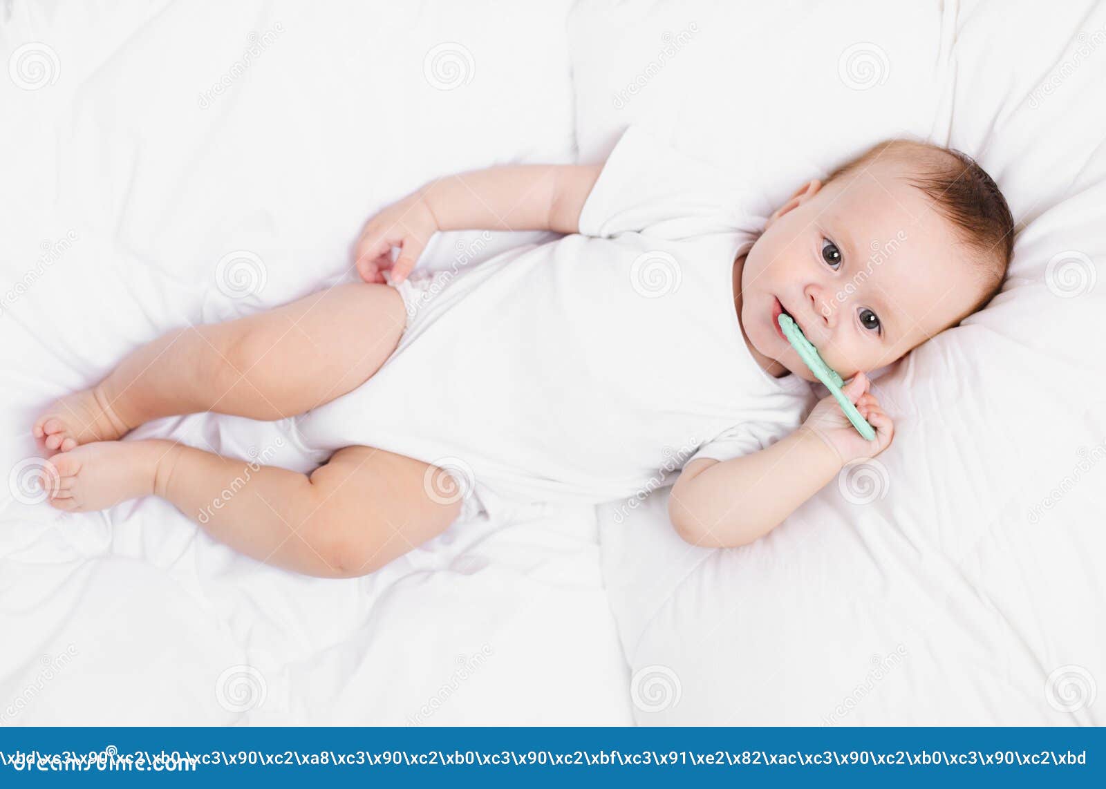 A Baby with a Teether on a White Background . Teething. Children& X27;s ...