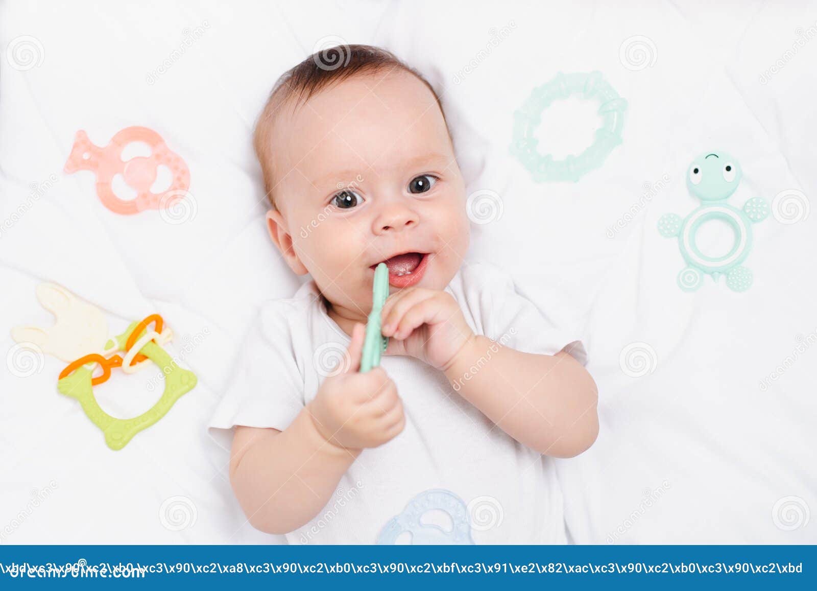A Baby with a Teether on a White Background . Teething. Children& X27;s ...