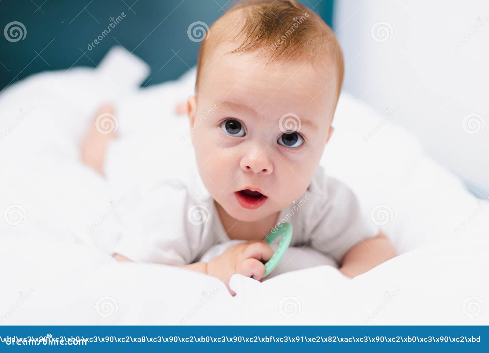 A Baby with a Teether on a White Background . Teething. Children& X27;s ...