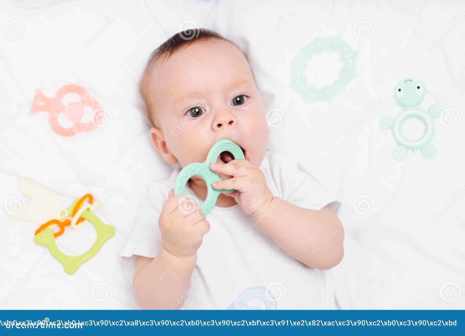 A Baby with a Teether on a White Background . Teething. Children& X27;s ...