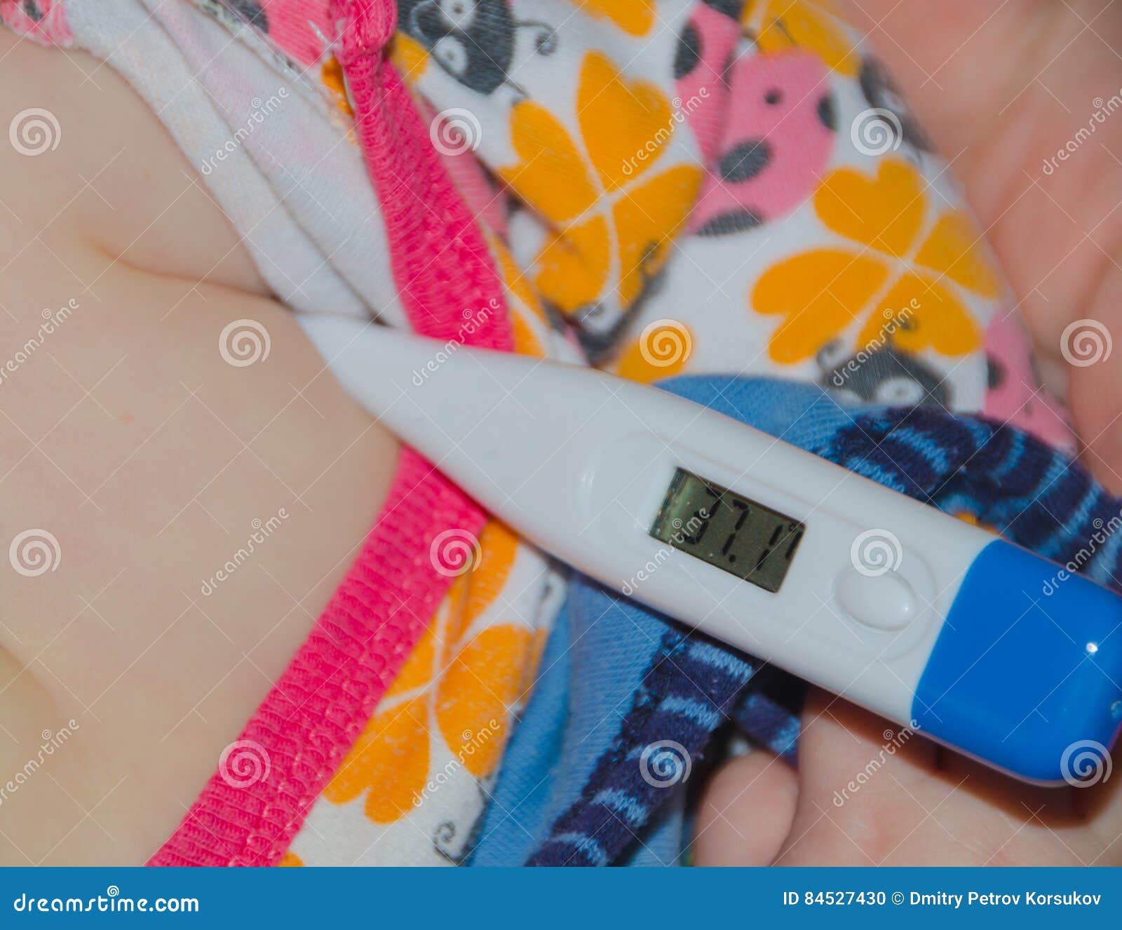 The Baby with a Thermometer in the Mouse, Measures the Temperature of ...