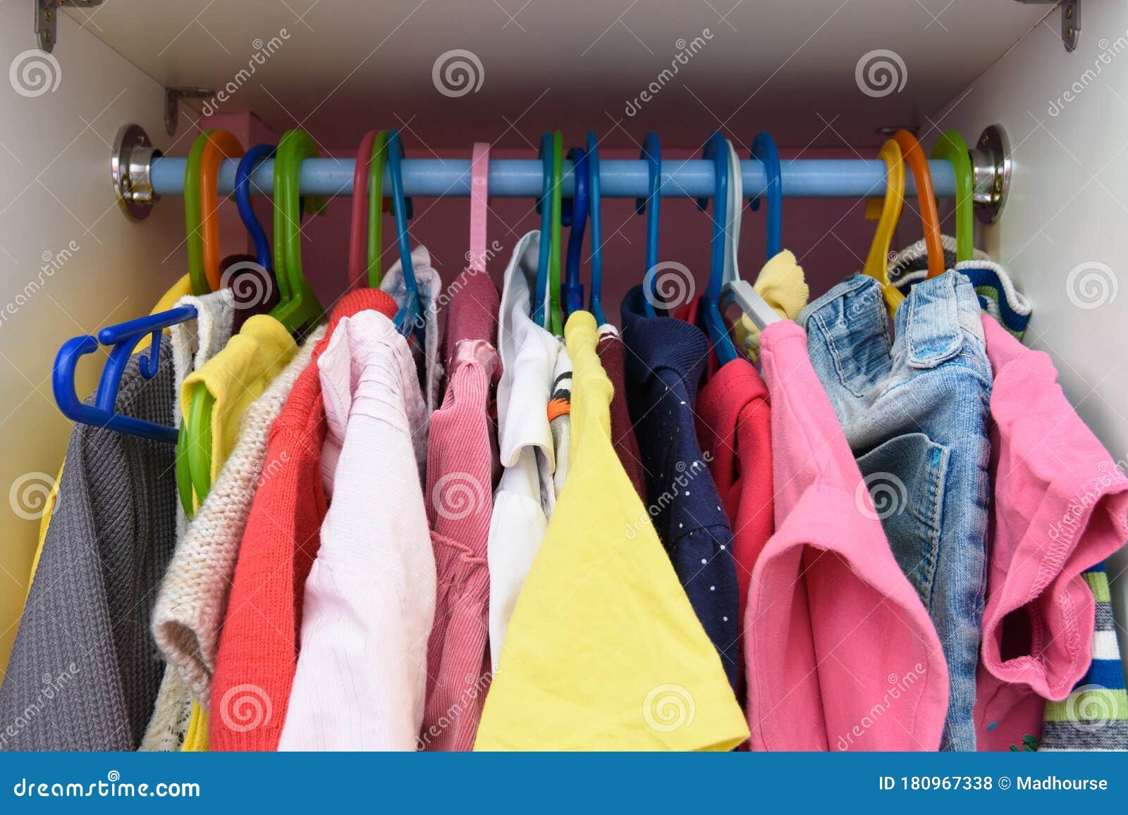 Baby Things are Hanging in the Closet on Hangers Stock Photo - Image of ...