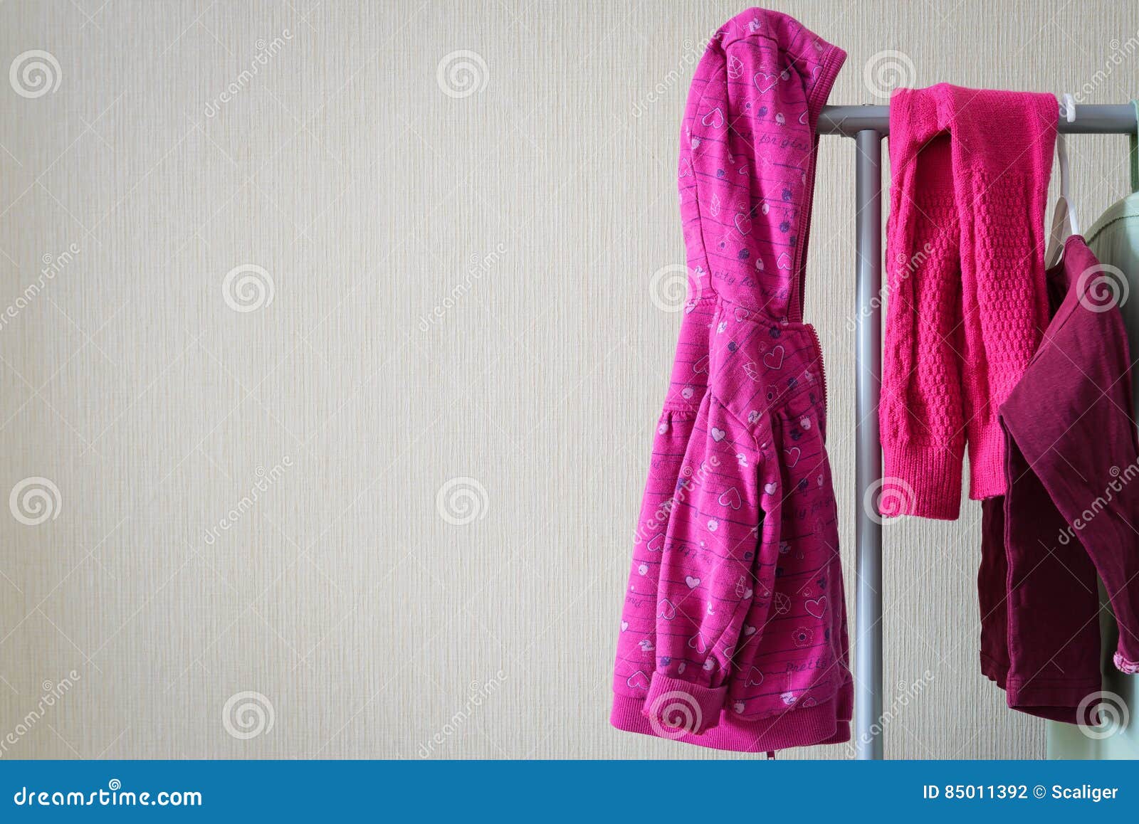 Baby Things Hanging on a Hanger at Home Stock Photo - Image of folded ...
