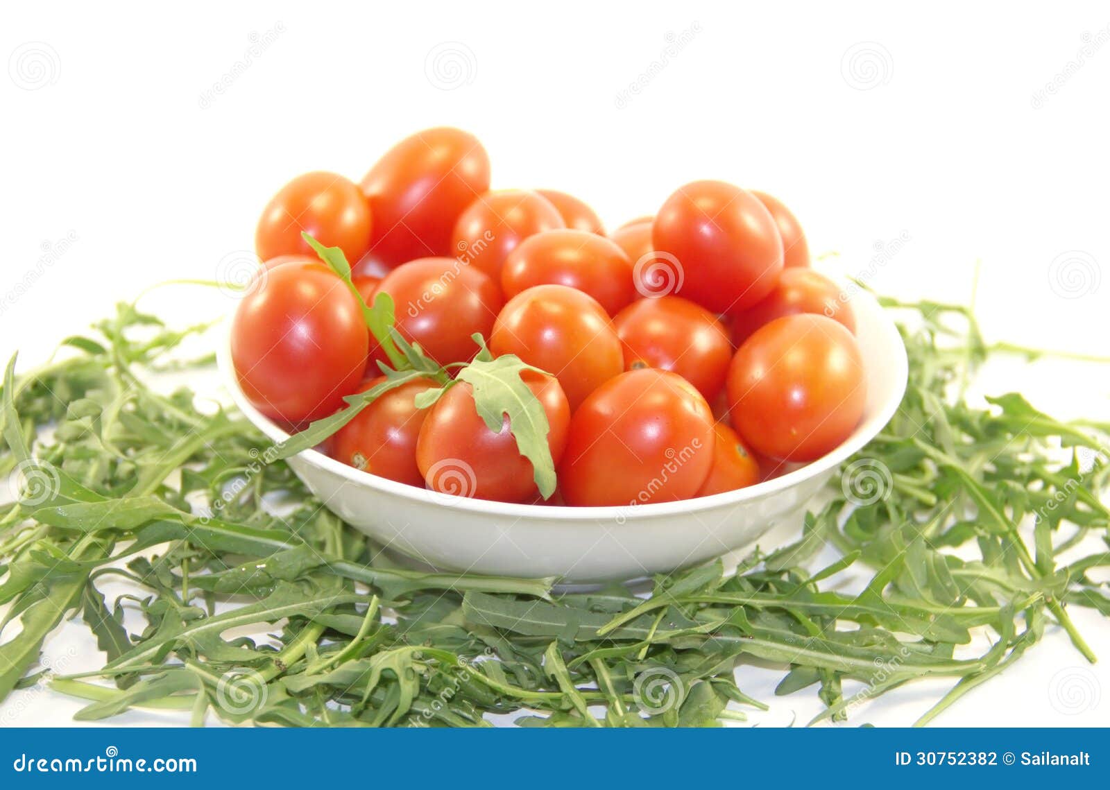 Baby tomatoes and rocket stock photo. Image of plate - 30752382