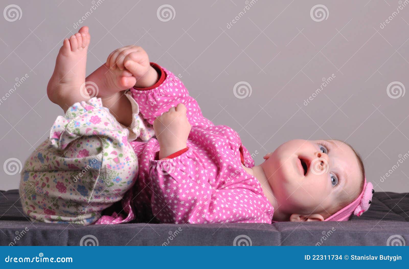 Baby touching his leg stock photo. Image of minor, funny - 22311734