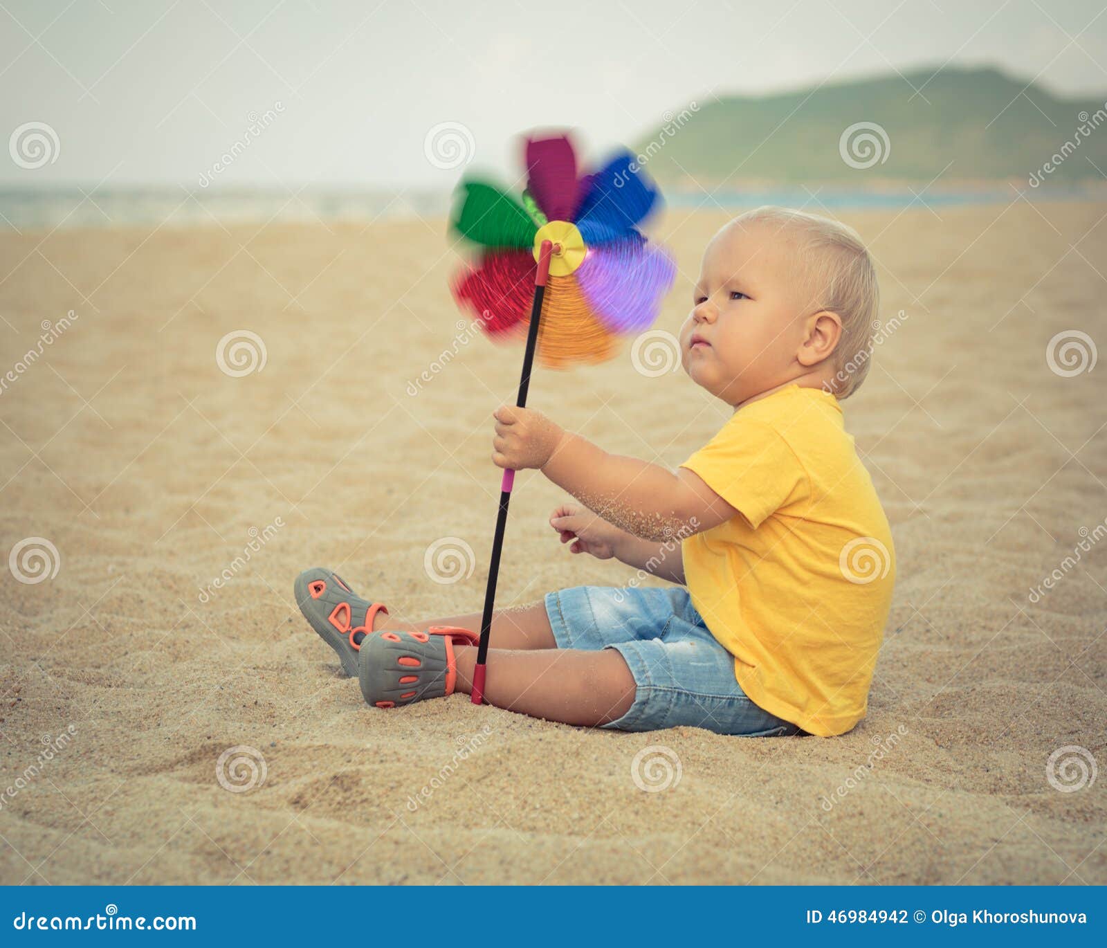 Baby with toy windmill stock photo. Image of leisure - 46984942