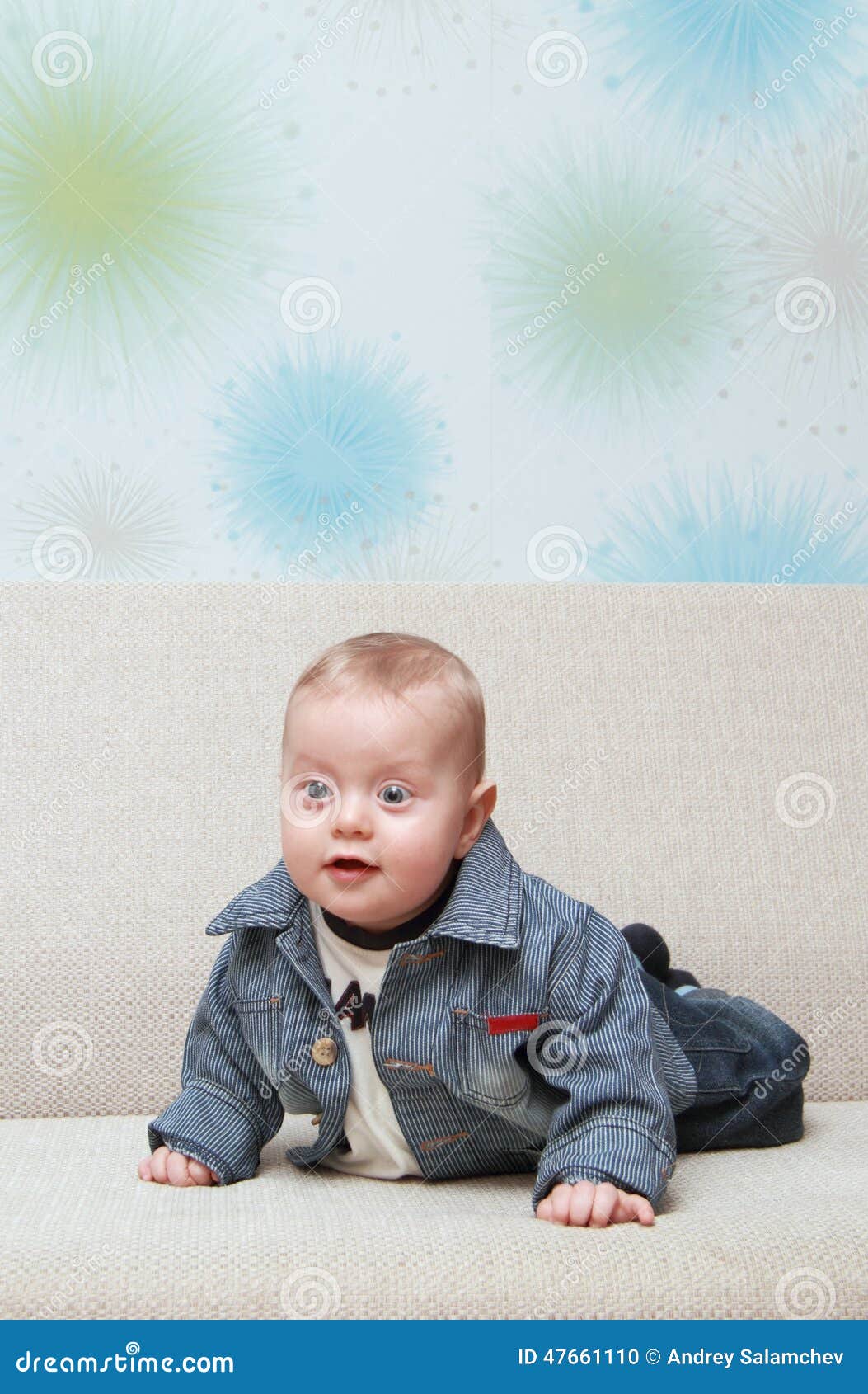 Baby try to creep on couch stock photo. Image of happy - 47661110