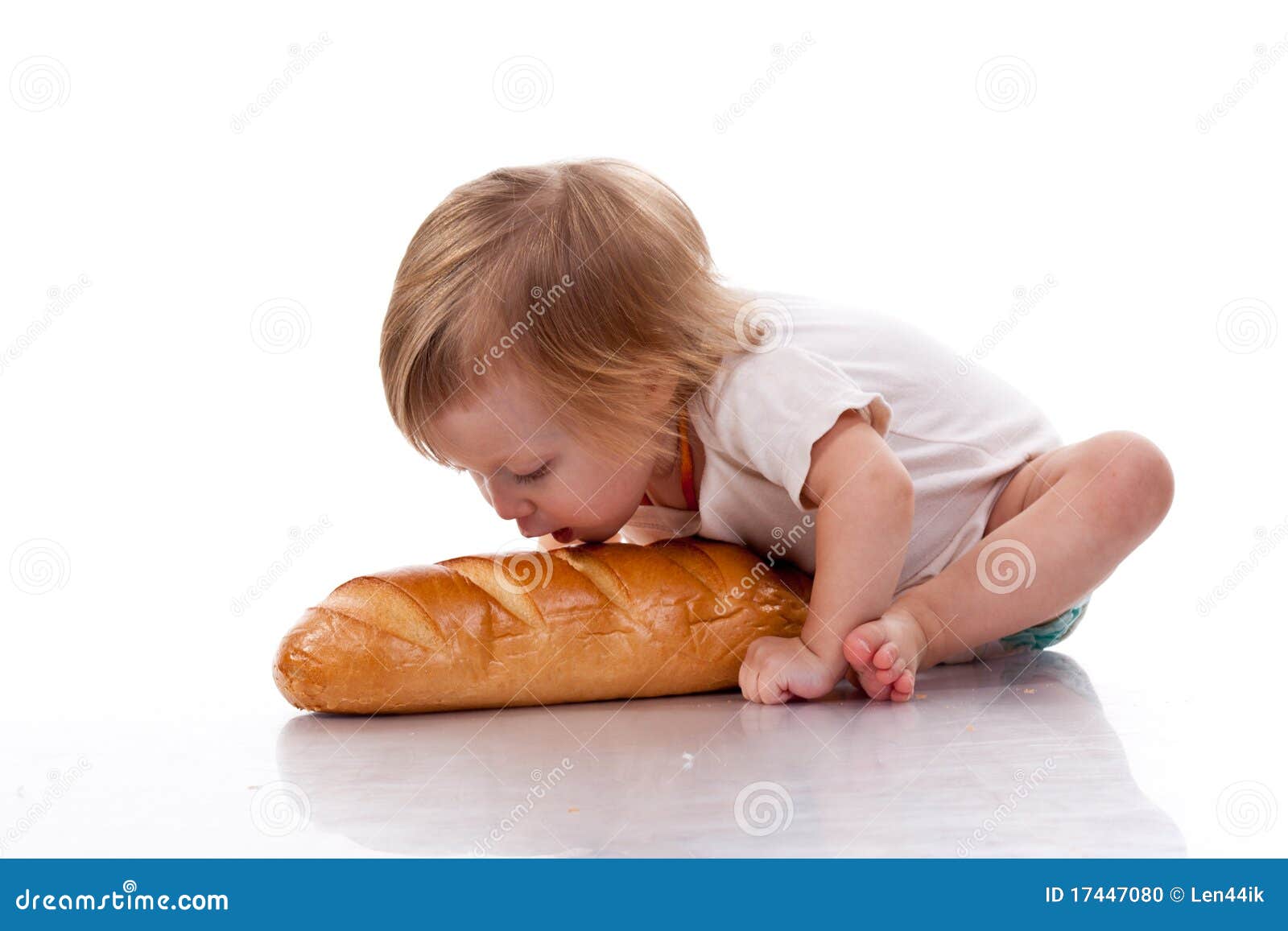 Baby Trying To Bite a Loaf of Bread Stock Photo - Image of bread ...