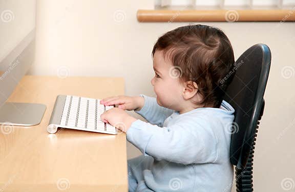 Baby typing on computer stock photo. Image of excited - 24430272