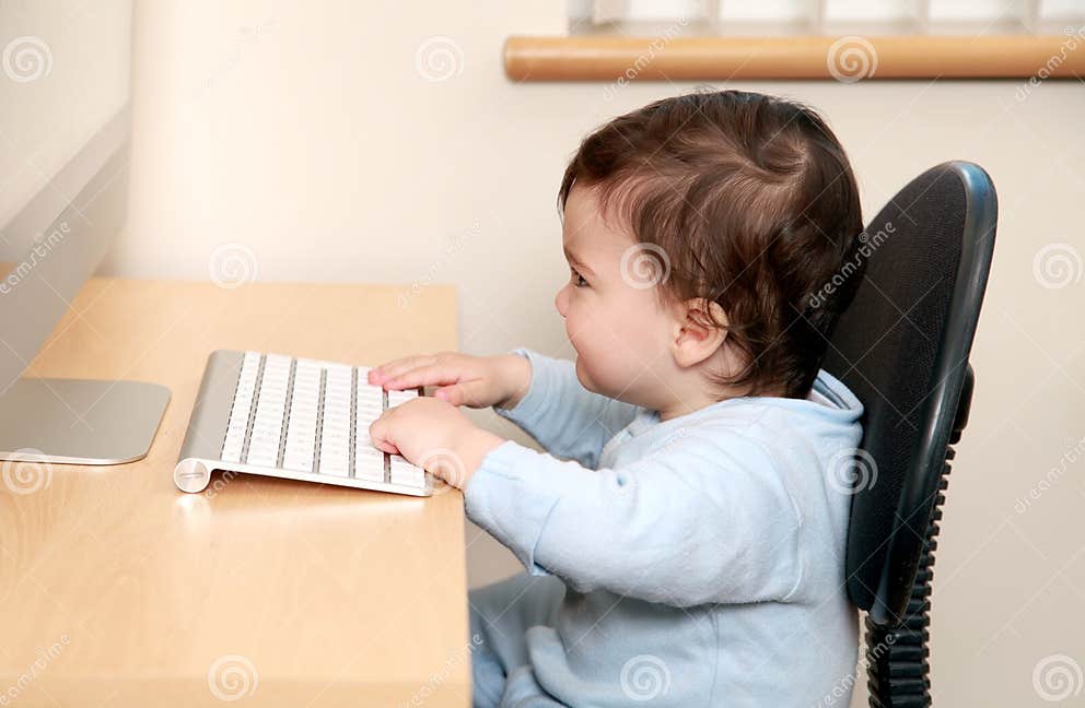 Baby typing on computer stock photo. Image of excited - 24430272