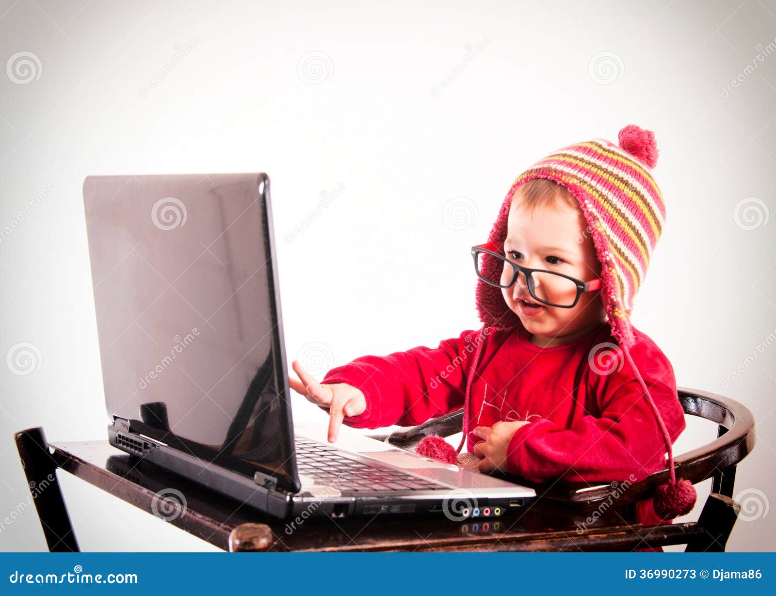 Baby typing on keyboard stock image. Image of display - 36990273