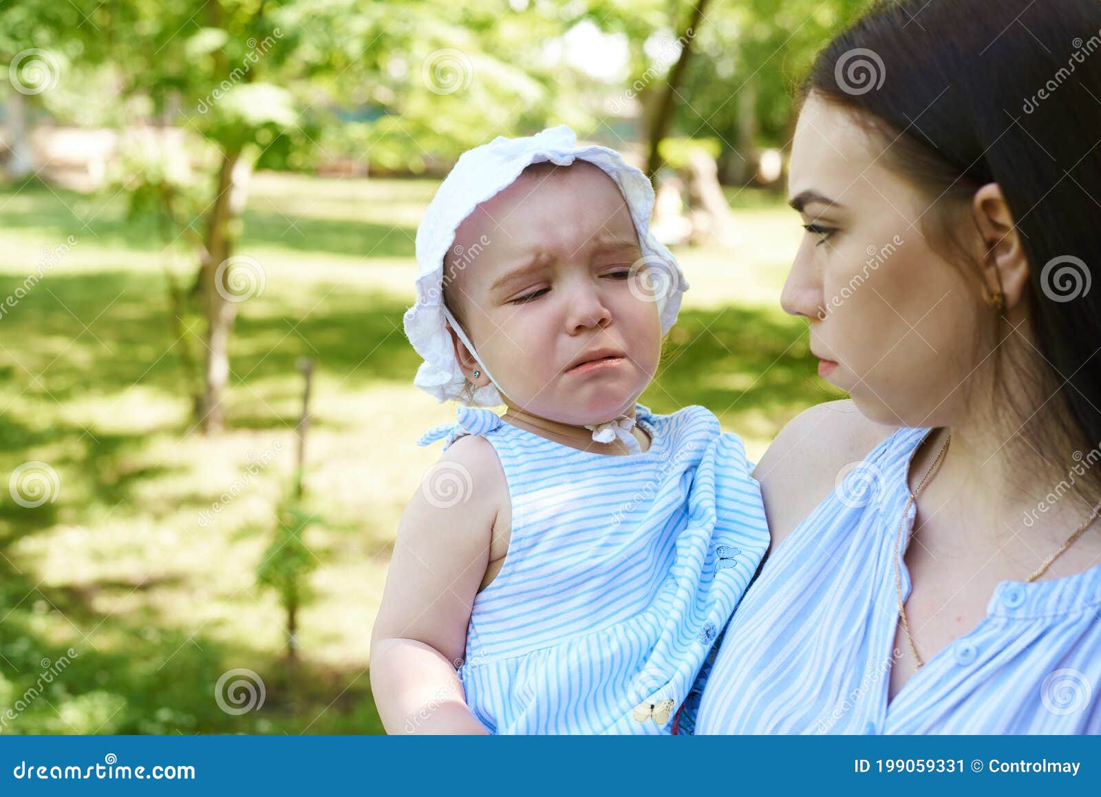A Baby is Upset. Mother is Looking at Disappointed Daughter Stock Image ...
