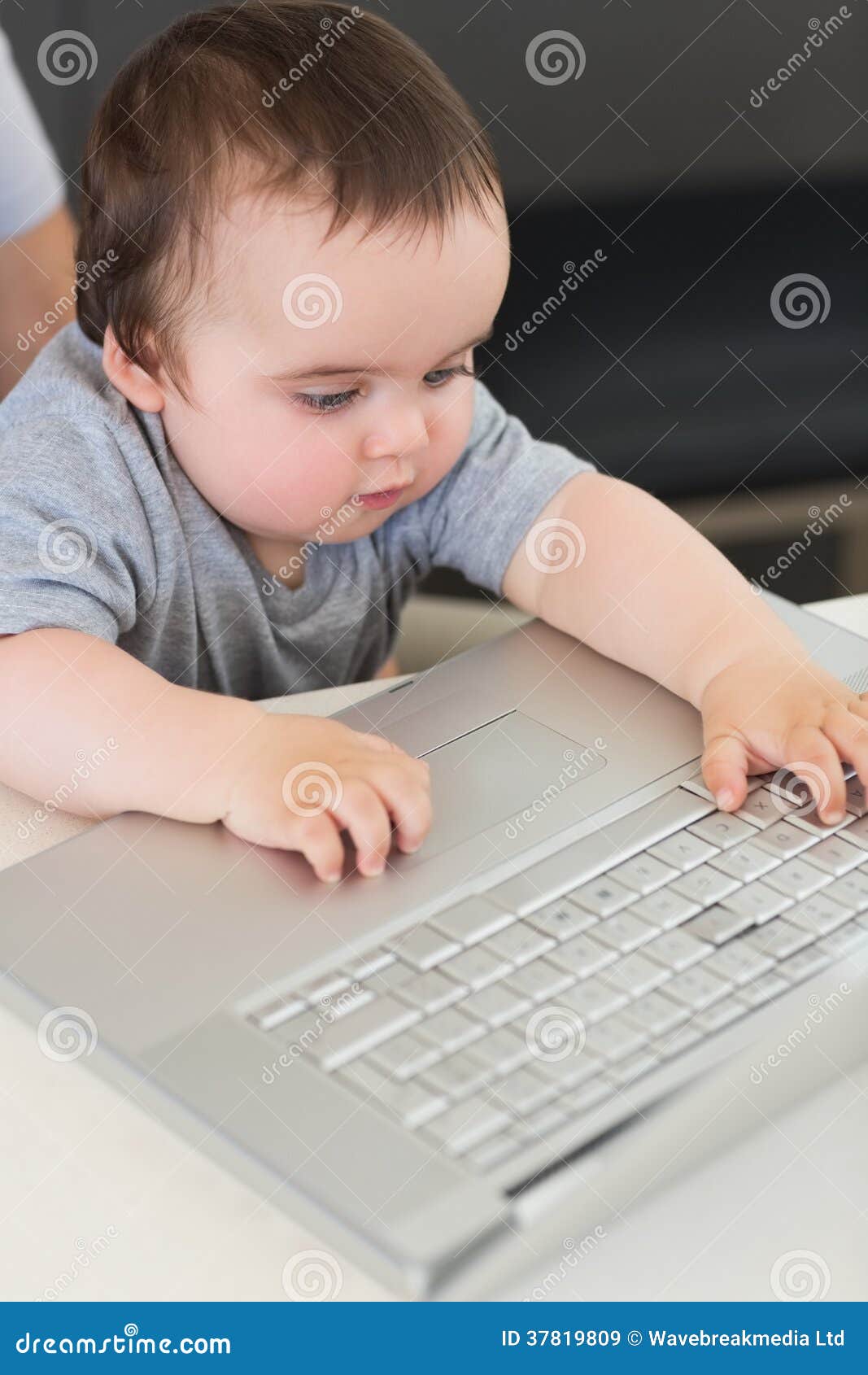 Baby using laptop at table stock image. Image of infant - 37819809
