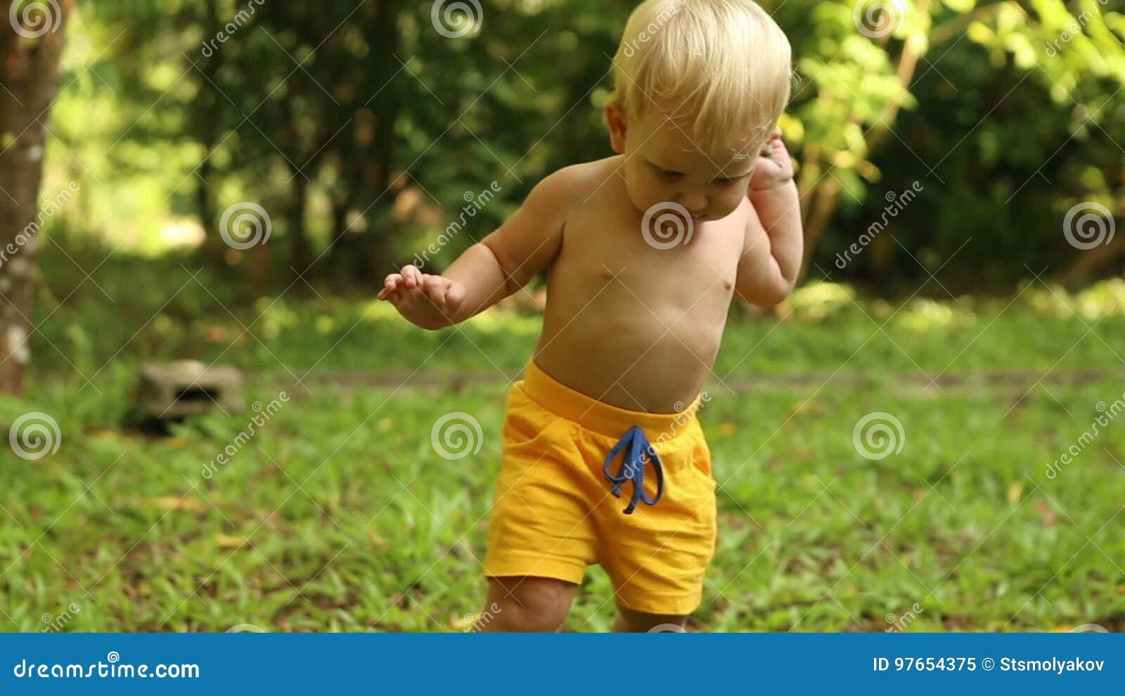 Baby Walking on the Grass and Digging in the Ground Stock Video - Video ...