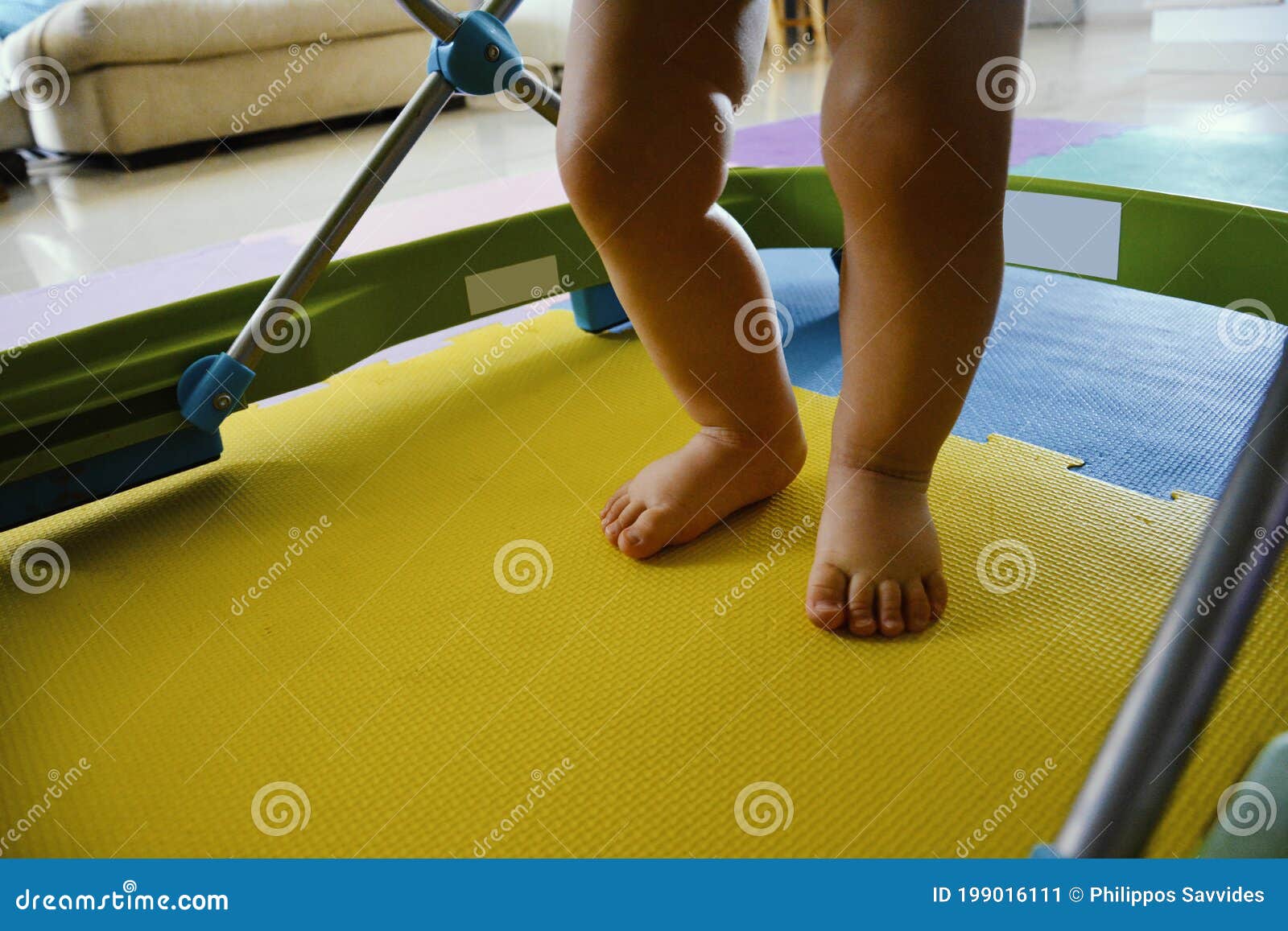 Baby Walking with the Help of a Walker Stock Image - Image of ...