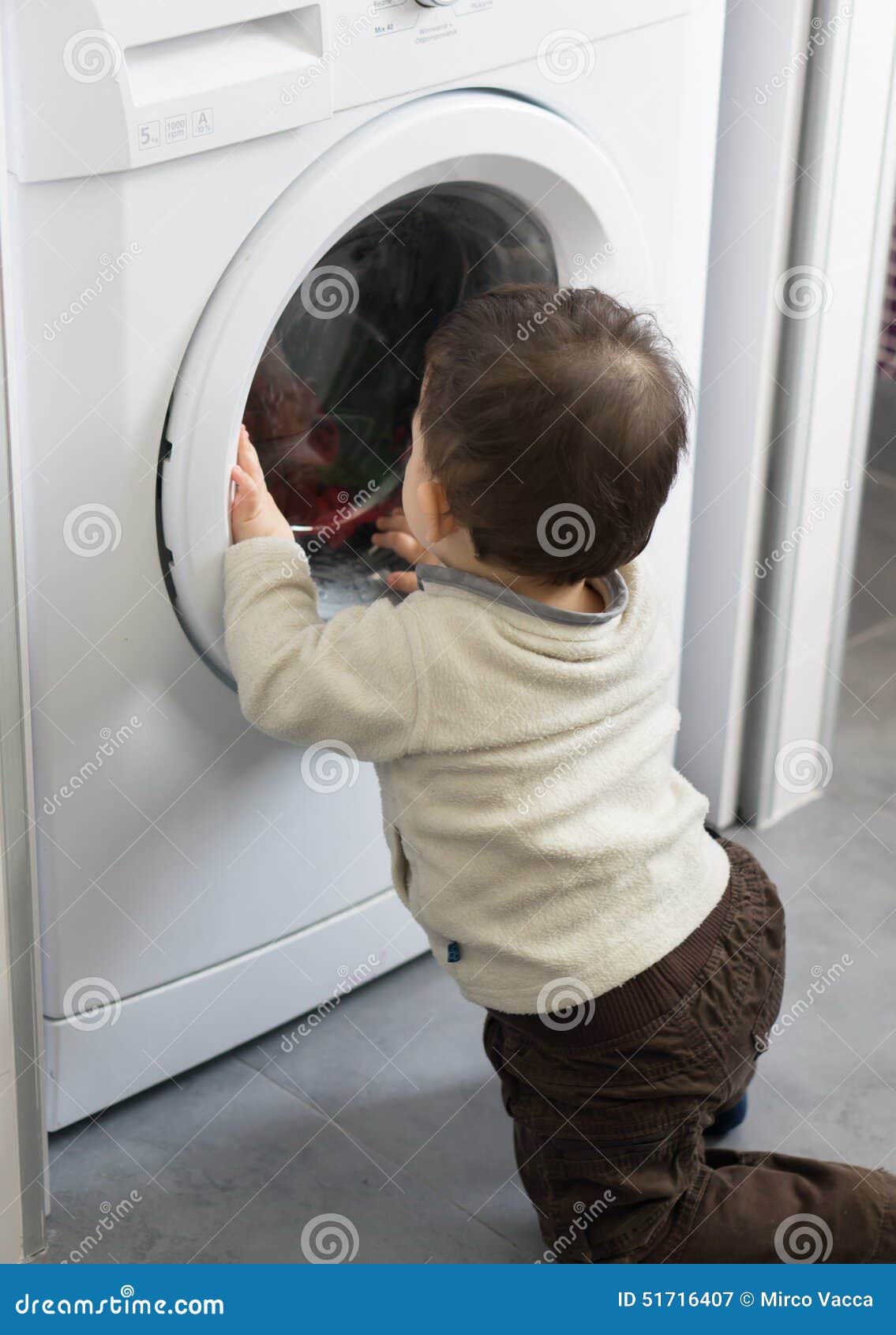 Baby and washing machine stock image. Image of washing - 51716407