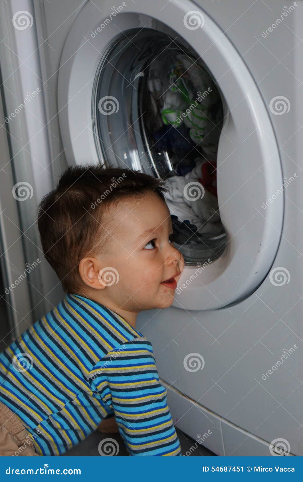 Baby and washing machine stock image. Image of looking - 54687451