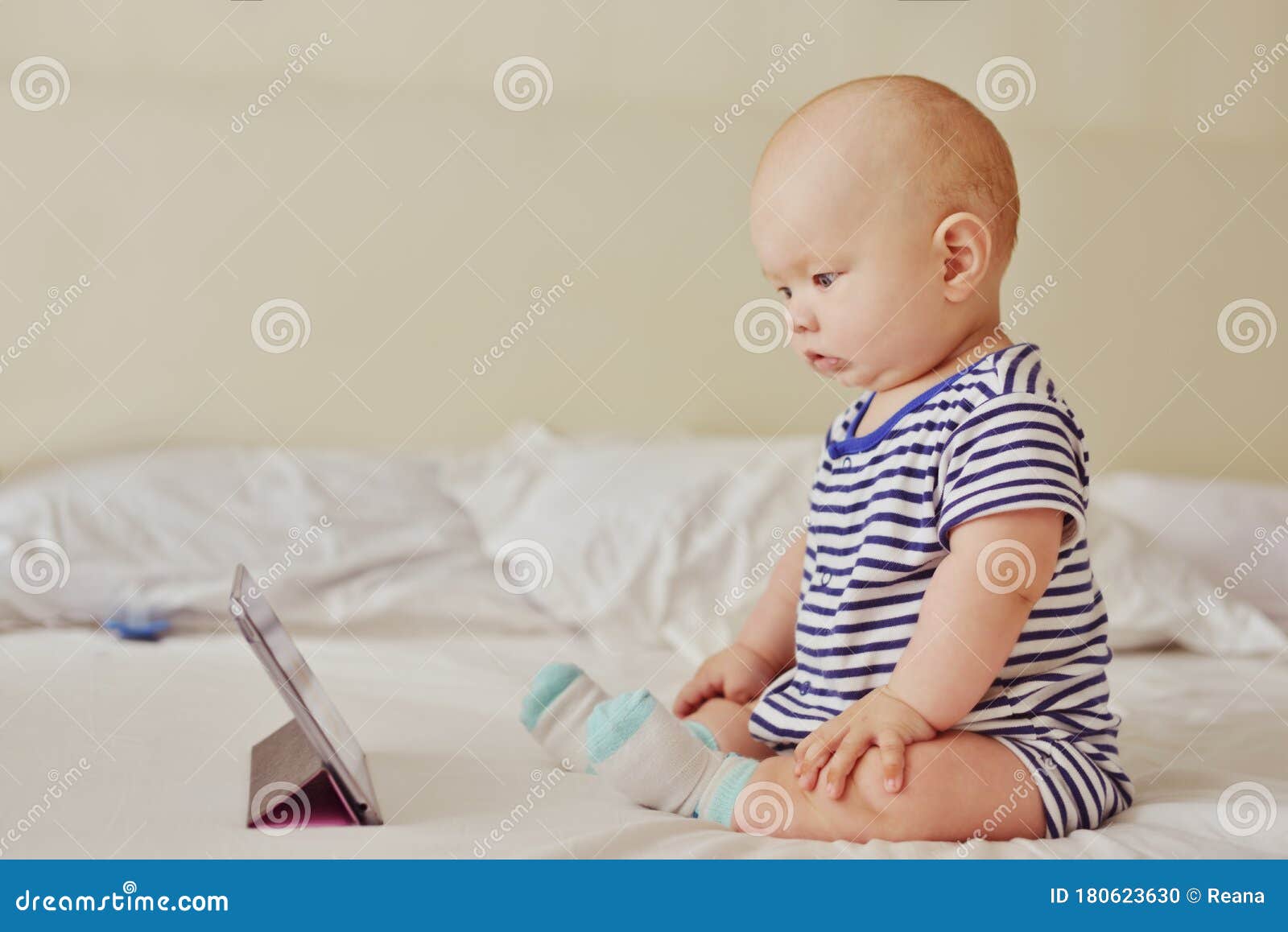 Baby watching tablet pc stock photo. Image of digital - 180623630
