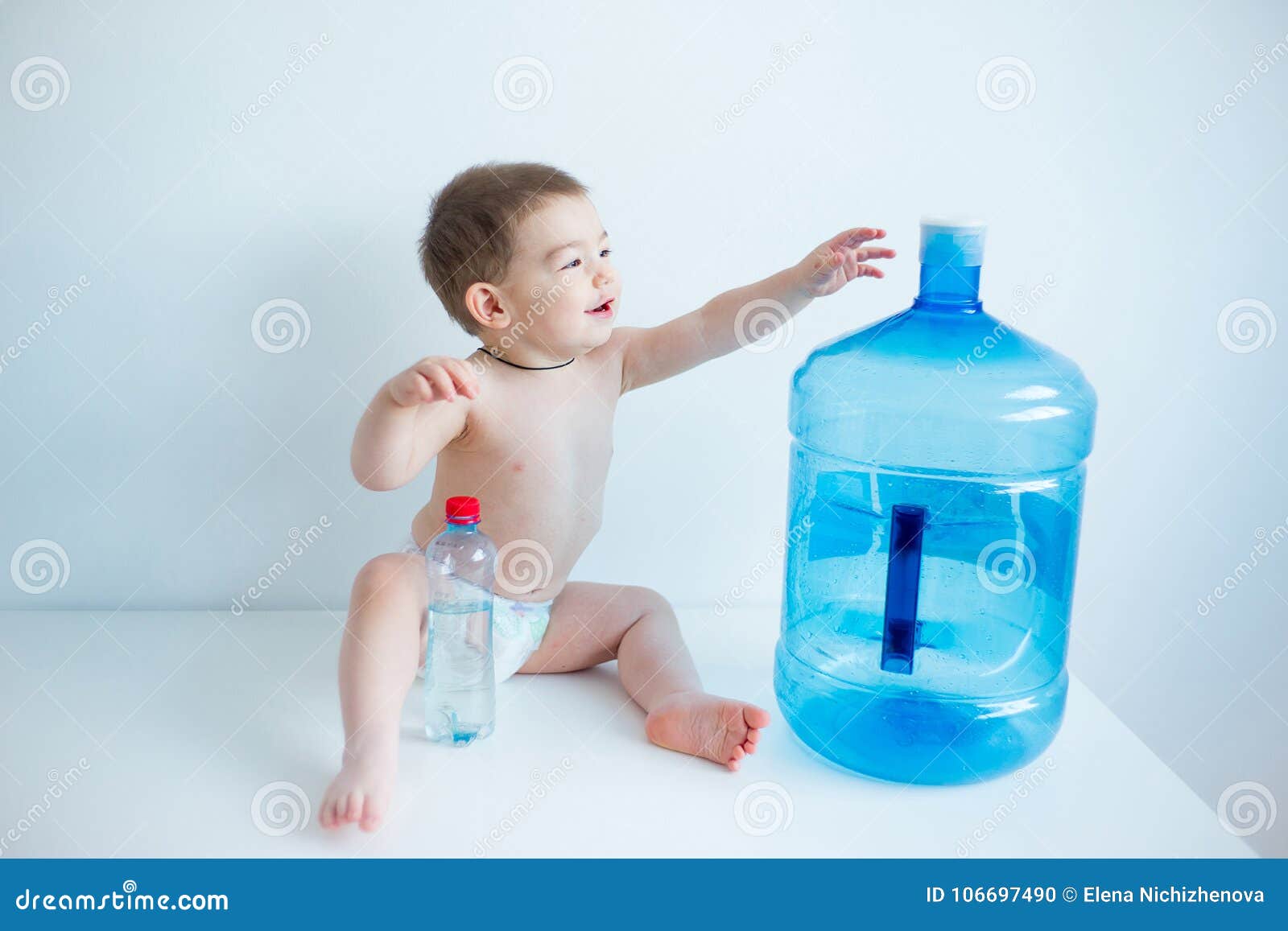 Baby with a water bottle stock photo. Image of beverage - 106697490