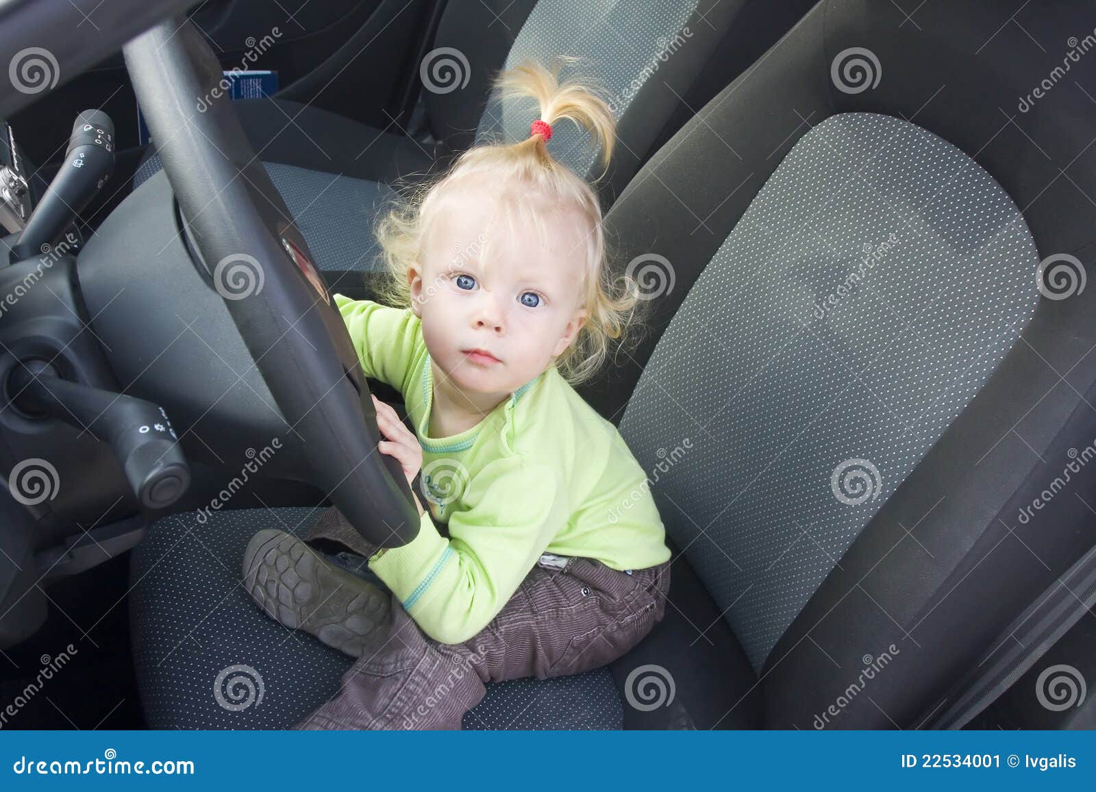 Baby at wheel stock image. Image of driving, family, eyes - 22534001