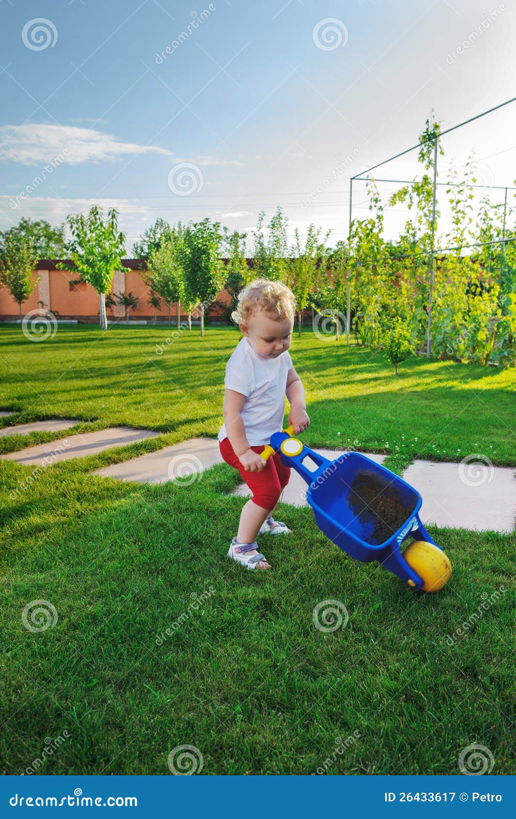 Baby with wheelbarrow stock image. Image of curly, happy - 26433617