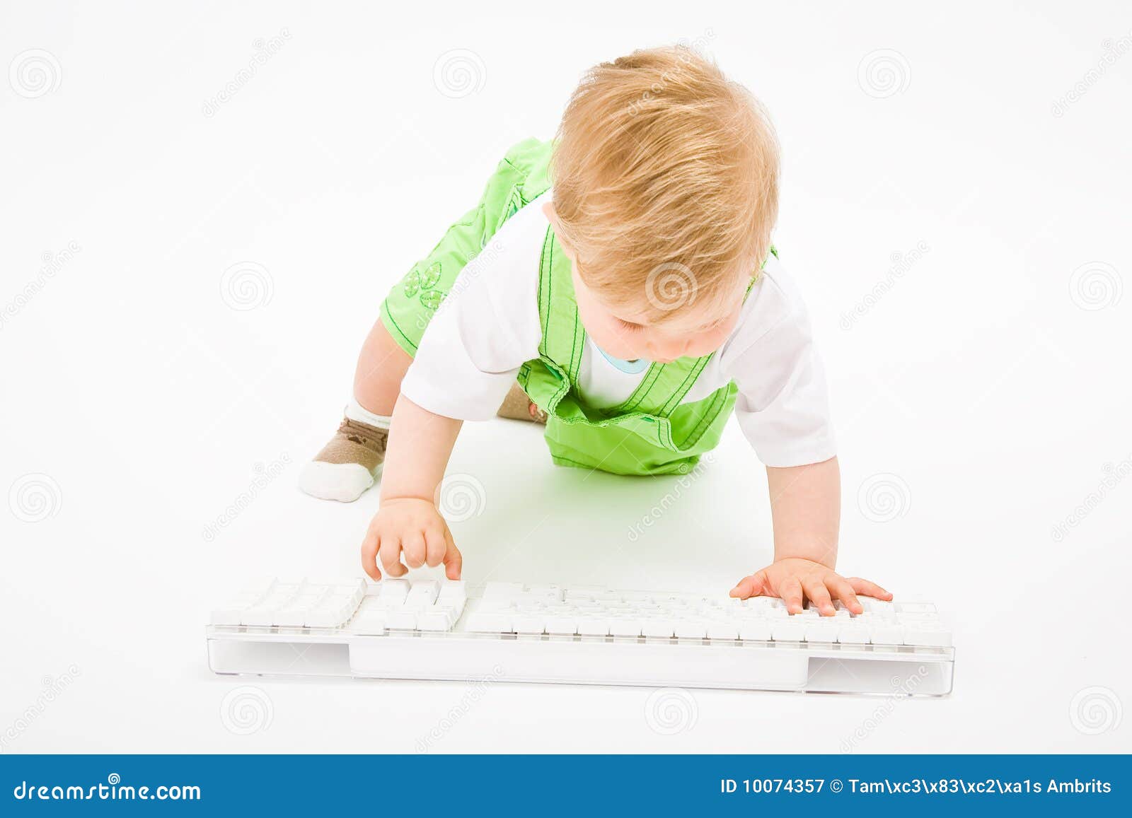 Baby with white keyboard stock image. Image of child - 10074357