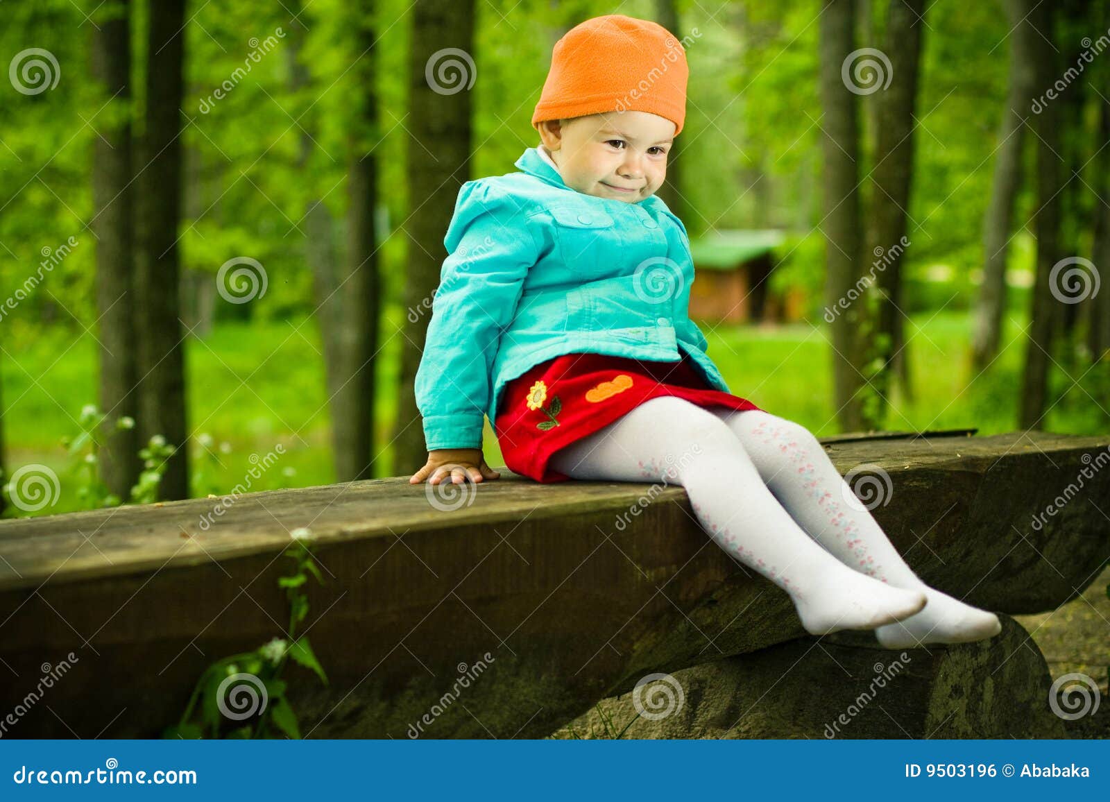 Baby on a wooden bench stock photo. Image of family, love - 9503196