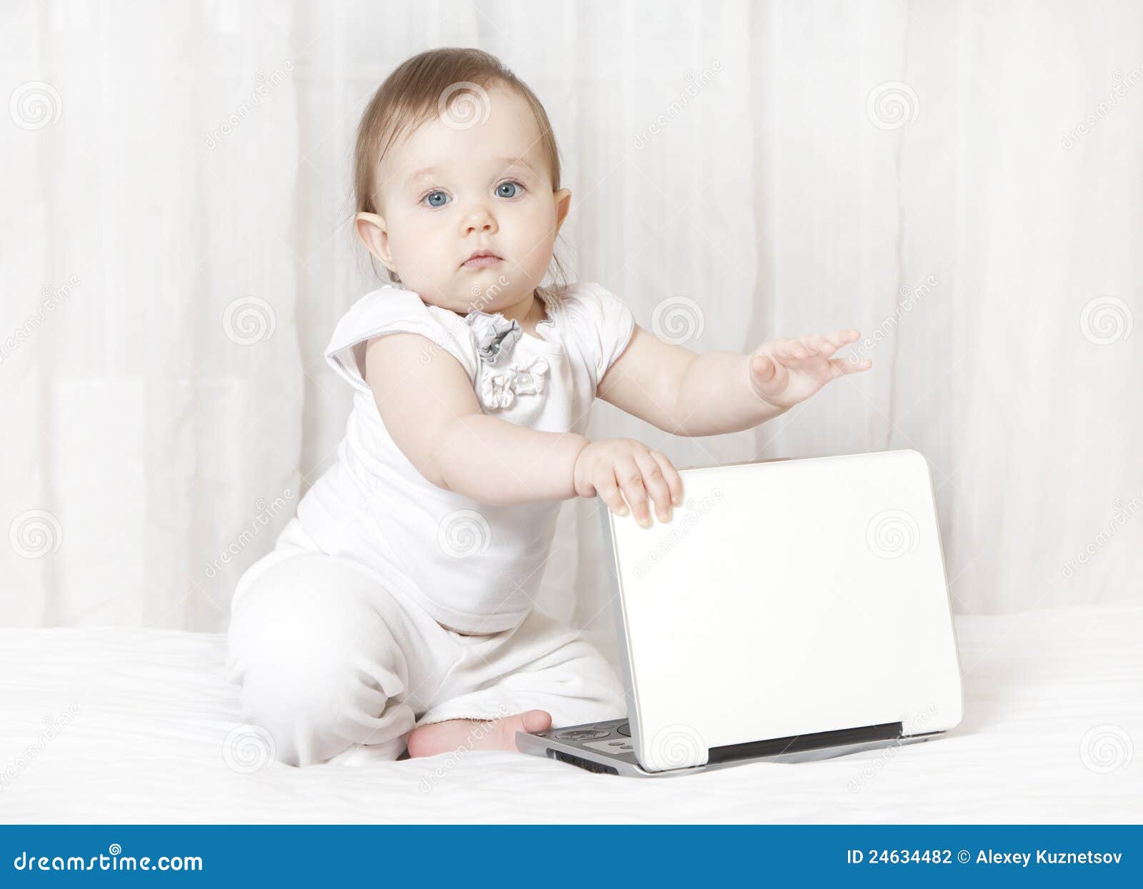 Baby working with a laptop stock photo. Image of interior - 24634482
