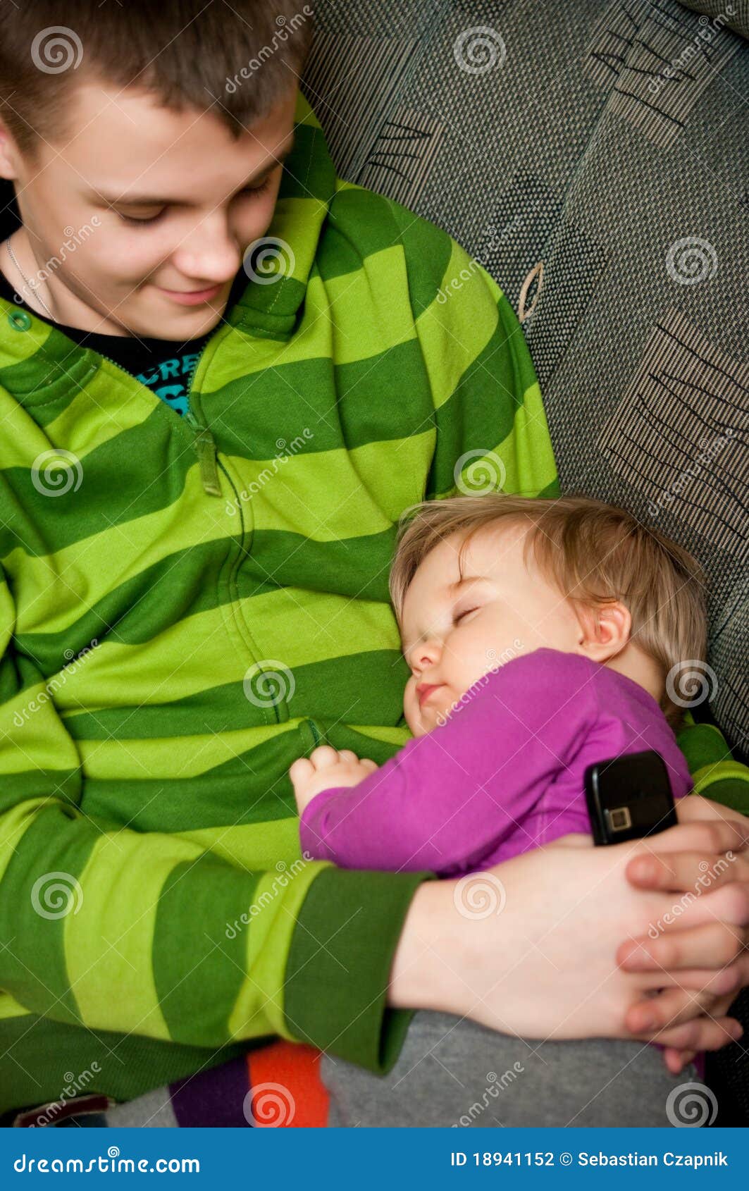 Babysitting stock photo. Image of phone, sleeps, hold - 18941152