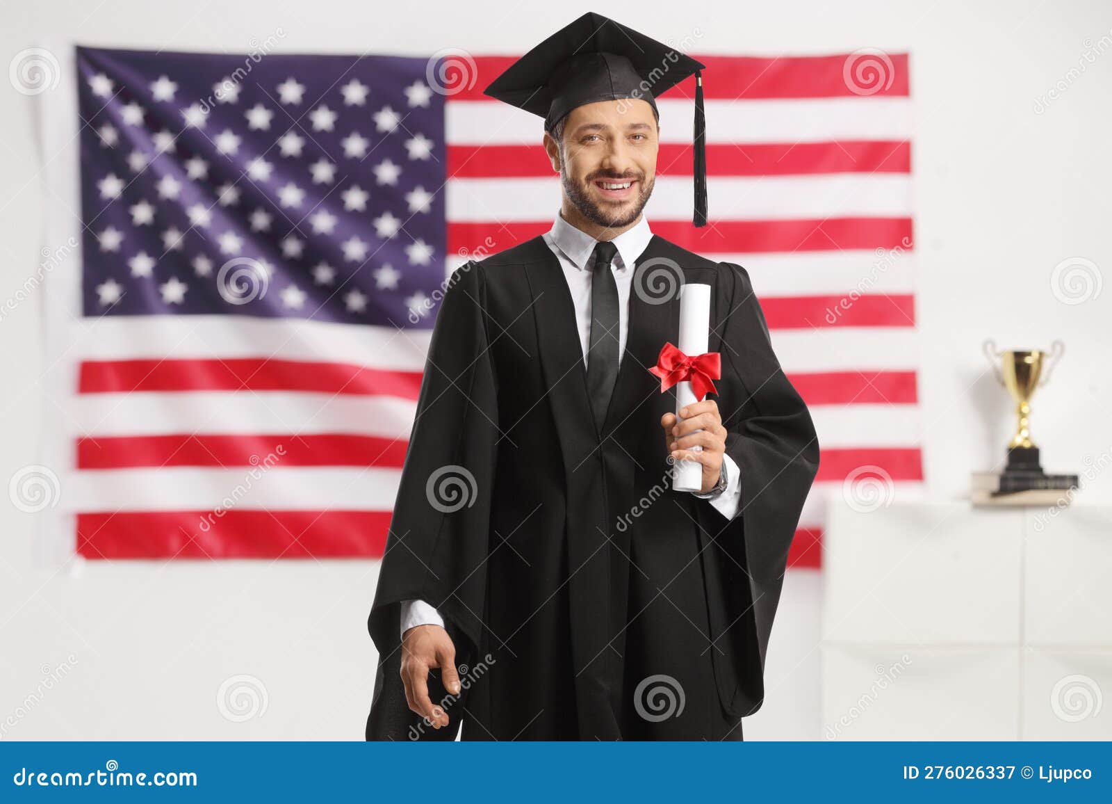 Bachelor Graduate Student Posing in Front of a USA Flag Stock Image ...