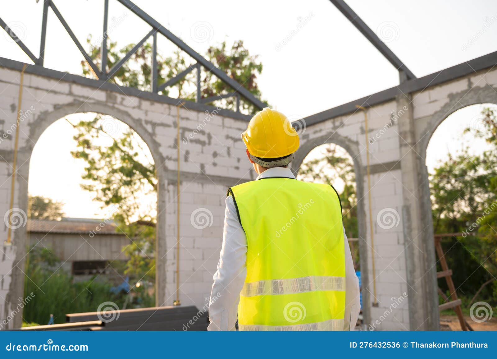 Back of Asian Engineering Man Looking To Construction Analyzing about ...