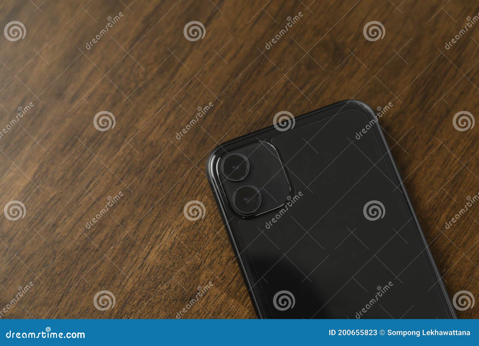 The Back of Black Smartphone on the Wood Table. Stock Image - Image of ...