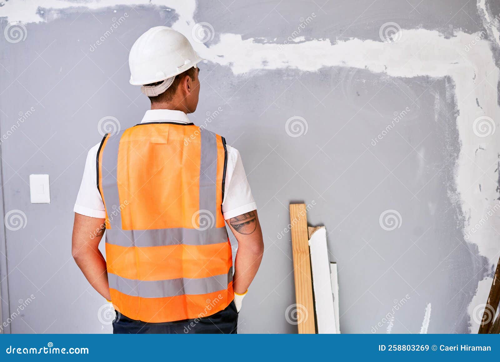 The Back of a Construction Worker in Uniform As he Faces Work in ...