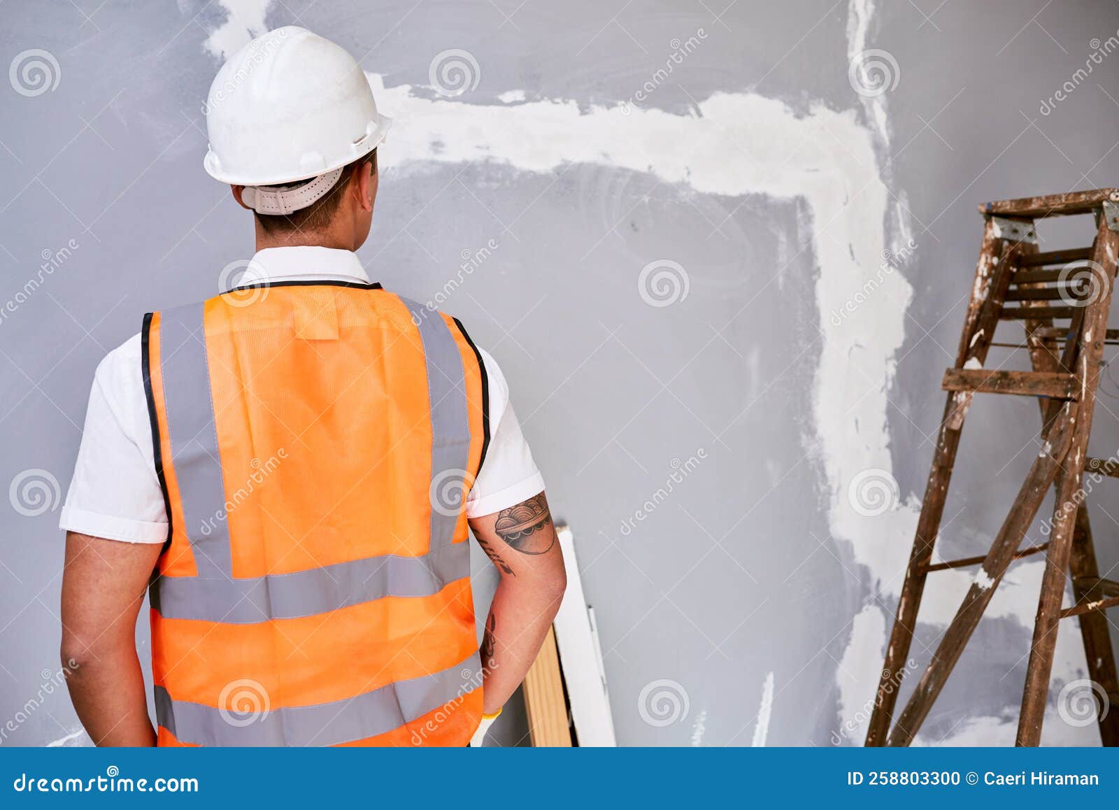 The Back of a Construction Worker in Uniform As he Faces Work in ...