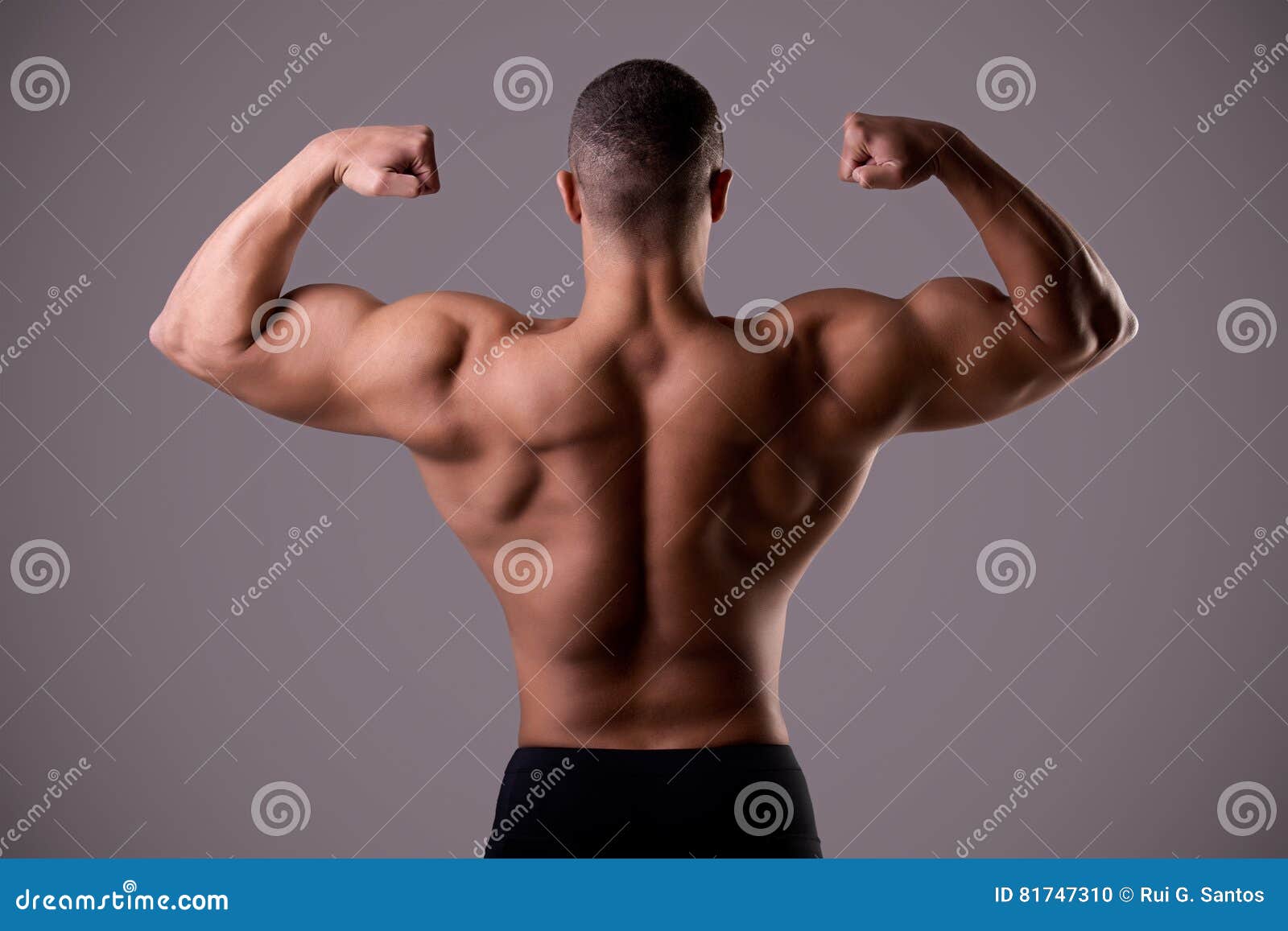 Back Double Biceps Pose By Brutal Caucasian Bodybuilder On Grunge ...