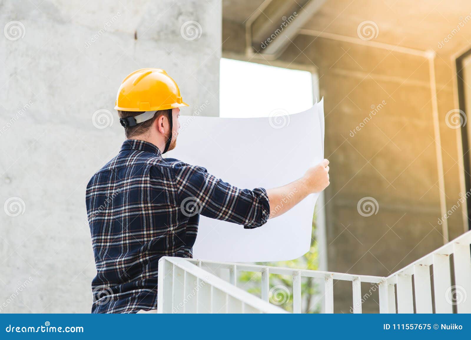 Engineer holding blueprint stock image. Image of modern - 111557675