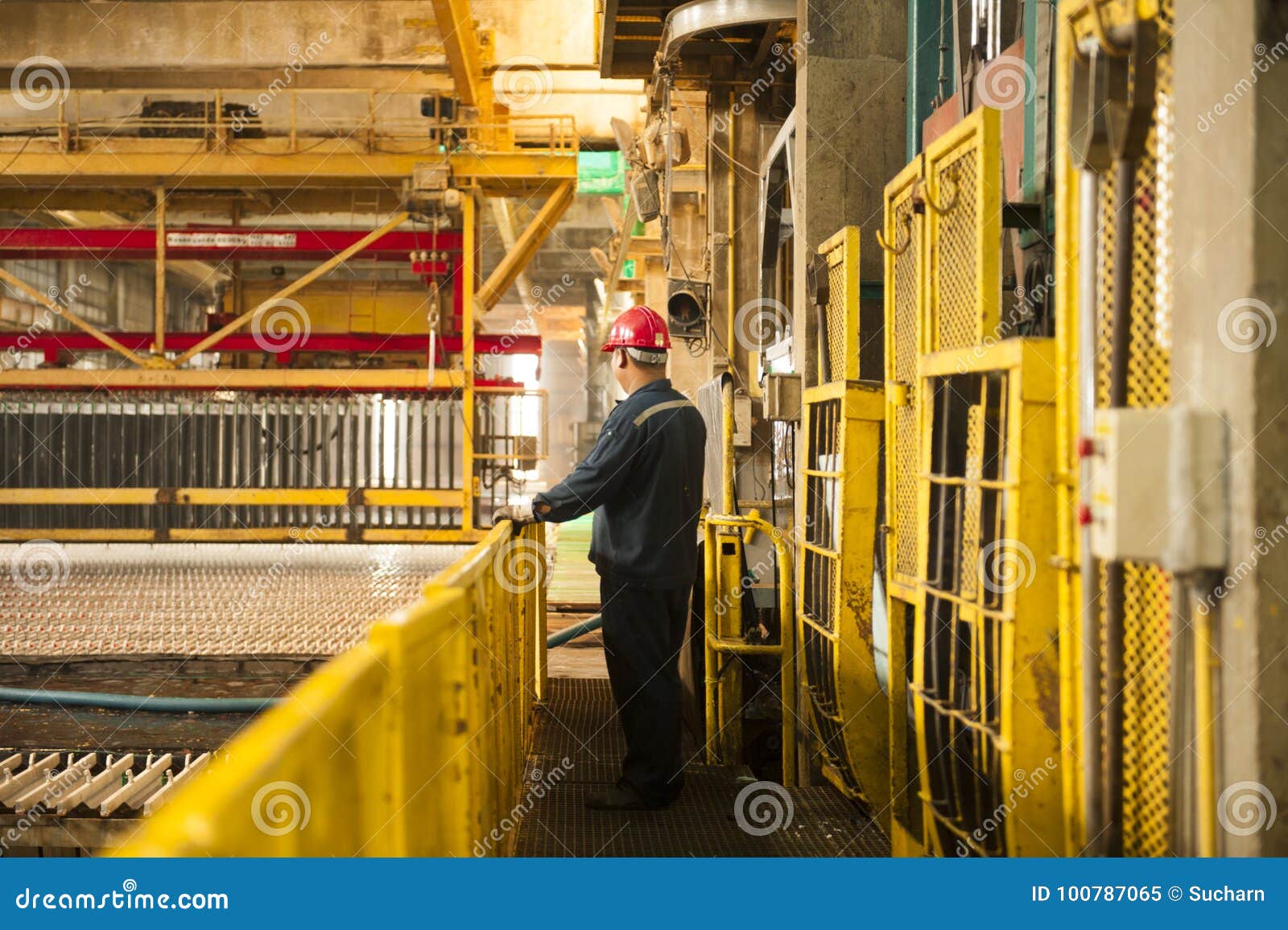 Back of Engineer Looking at the Factory Mining. Stock Image - Image of ...
