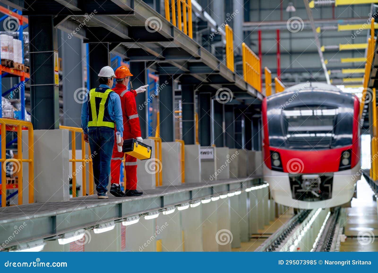 Back of Engineer and Technician Workers Bring Tool Box and Walk beside ...