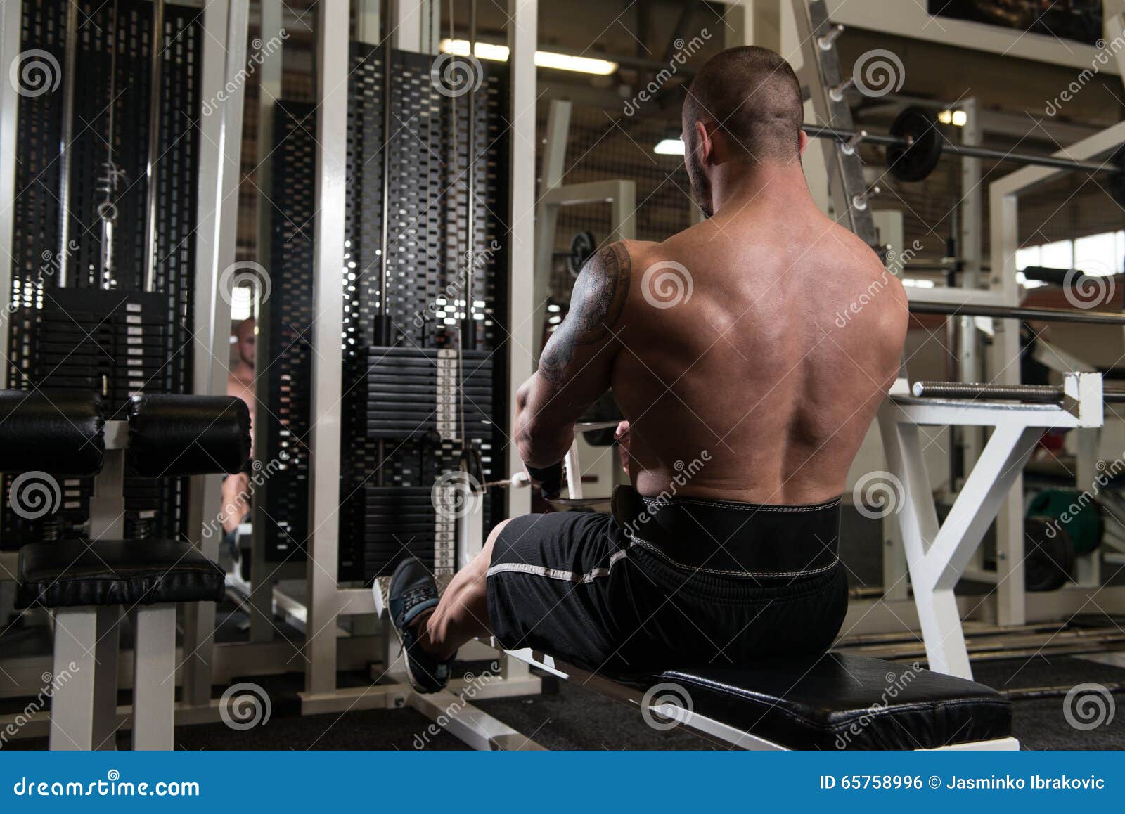 Back Exercises on a Seated Row Machine Stock Photo - Image of human ...
