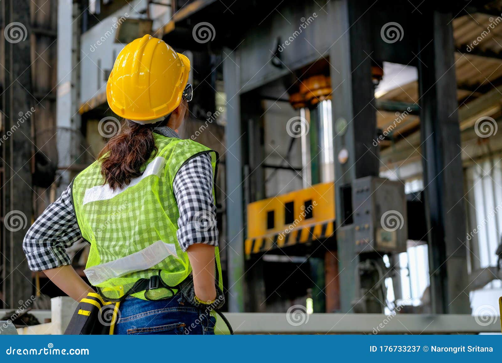 Back of Factory Worker Woman Stand and Look in Front of Machine in ...