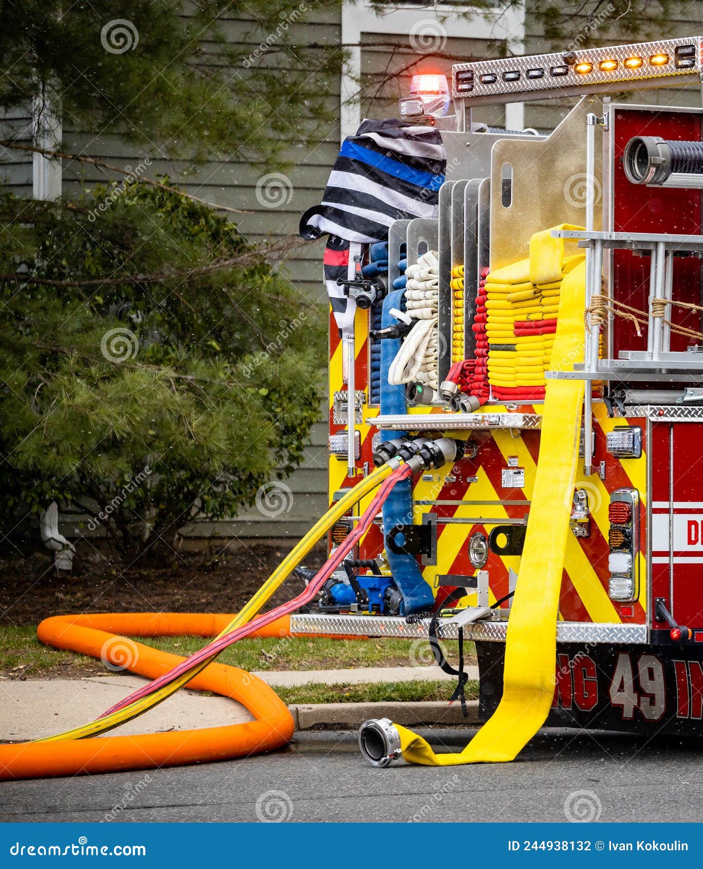 Back of the Firetruck with Hoses Equipment and Flag Stock Photo - Image ...