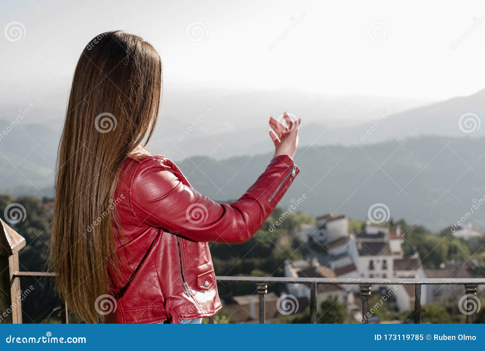 Back of Girl with Red Jacket Looking at the Landscape with Her Arm ...
