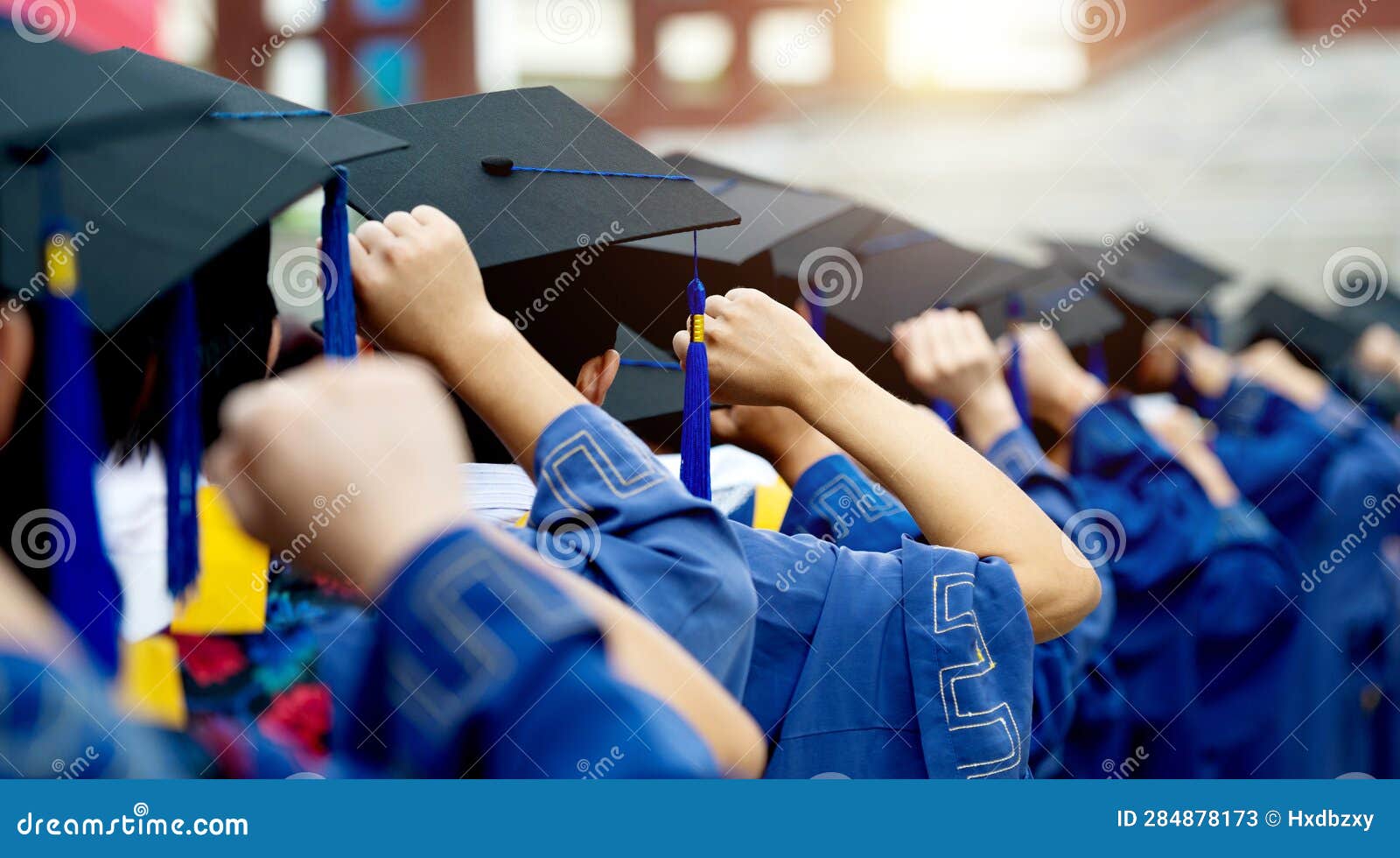 Back of Graduates Put Hands Up in a Row Stock Image - Image of ...