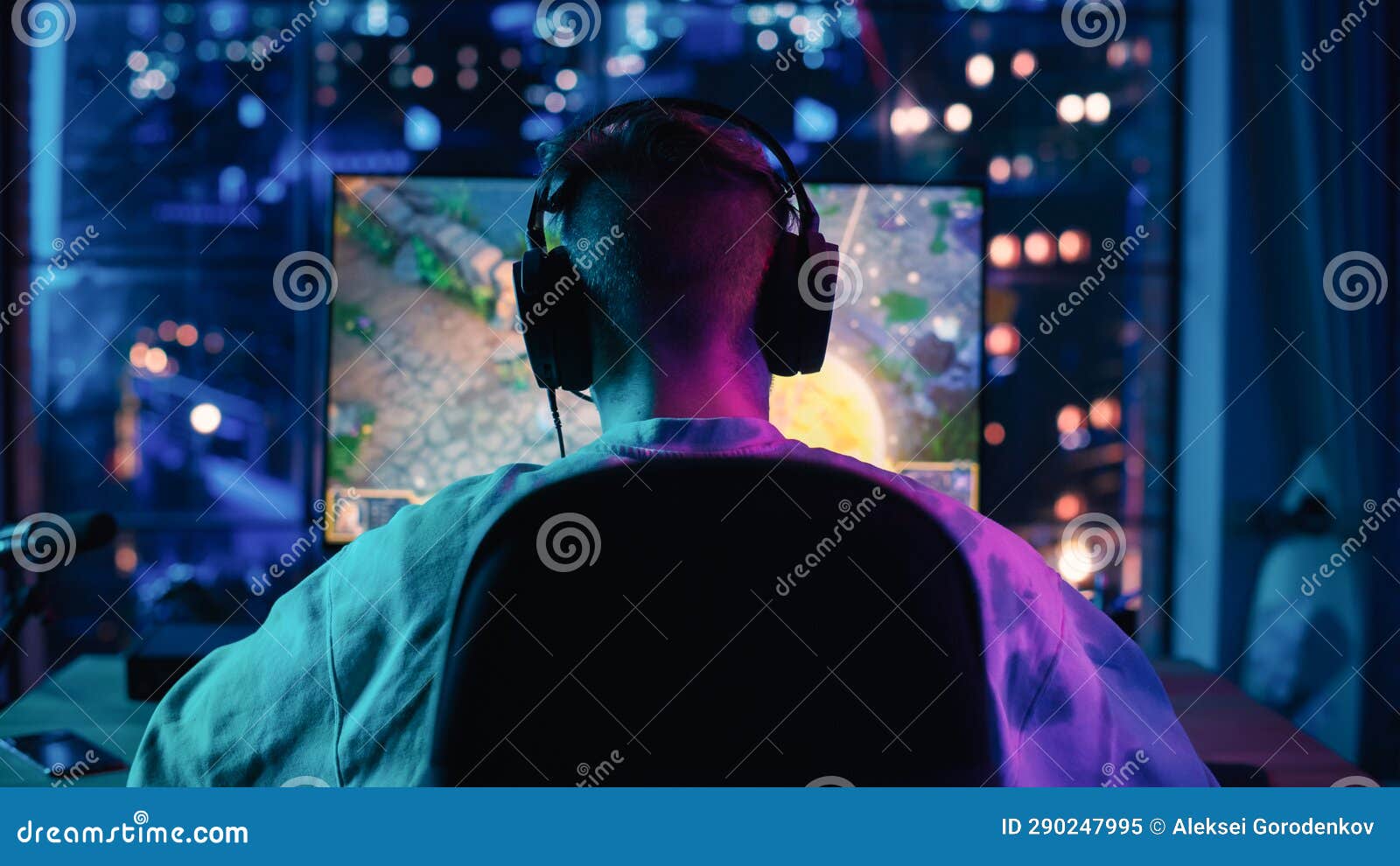 Back of the Head Angle of a Successful Gamer Playing a Video Game on ...