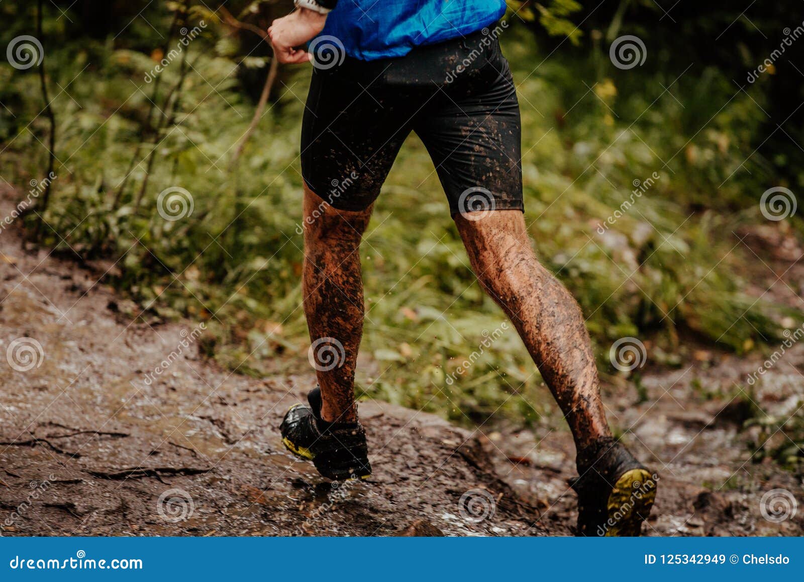 Back man runner in mud stock image. Image of nature - 125342949