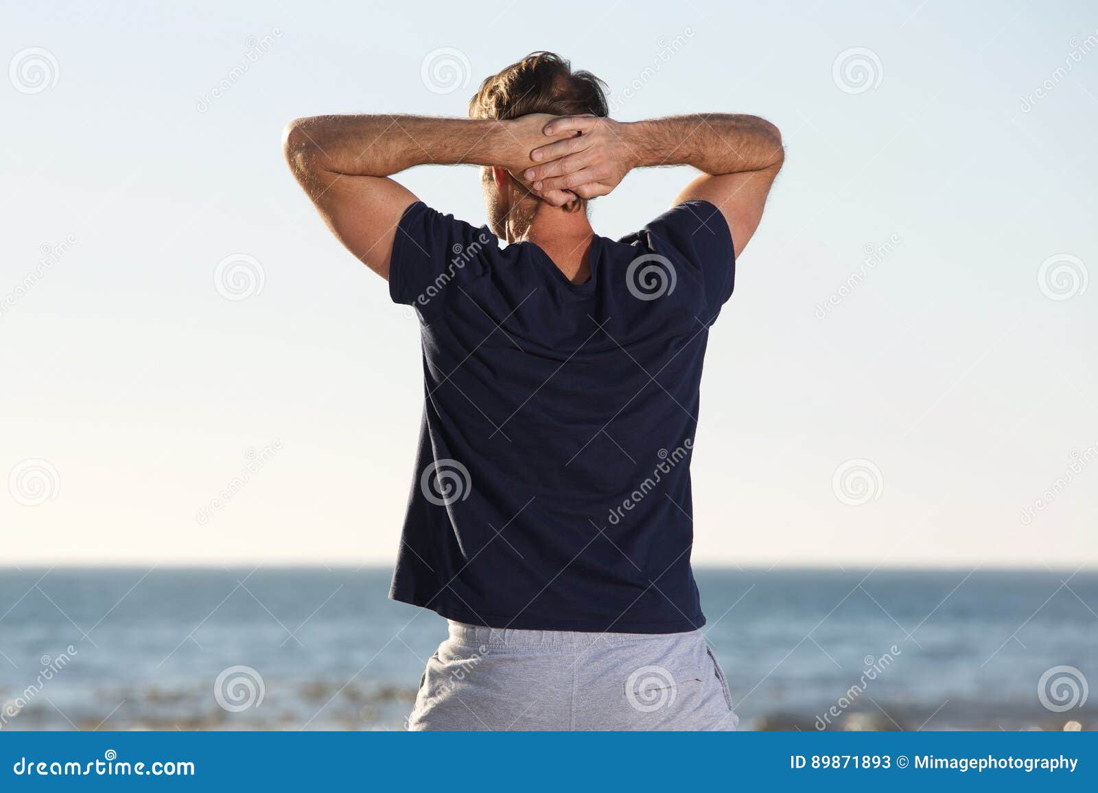 Back of Man Standing with Hands Behind Head Looking at Sea Stock Image ...