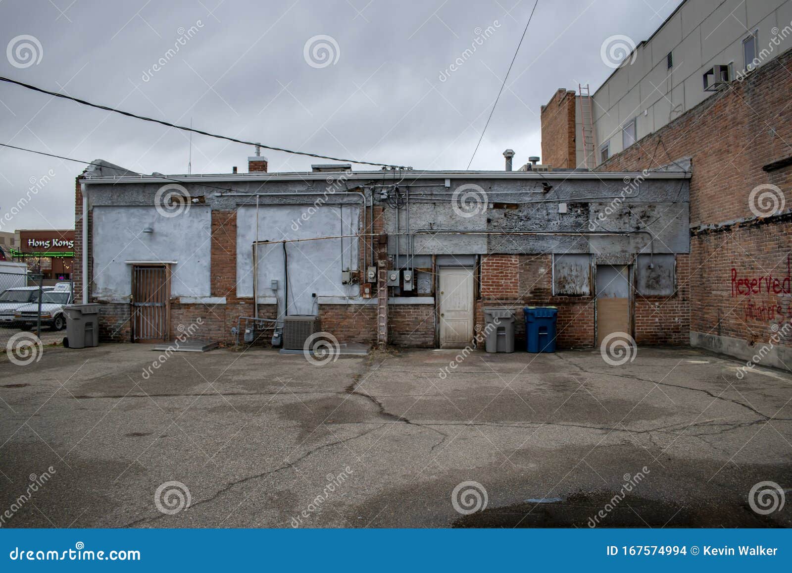 Back of an Old Downtown Building with Three Doors To the Insides Stock ...